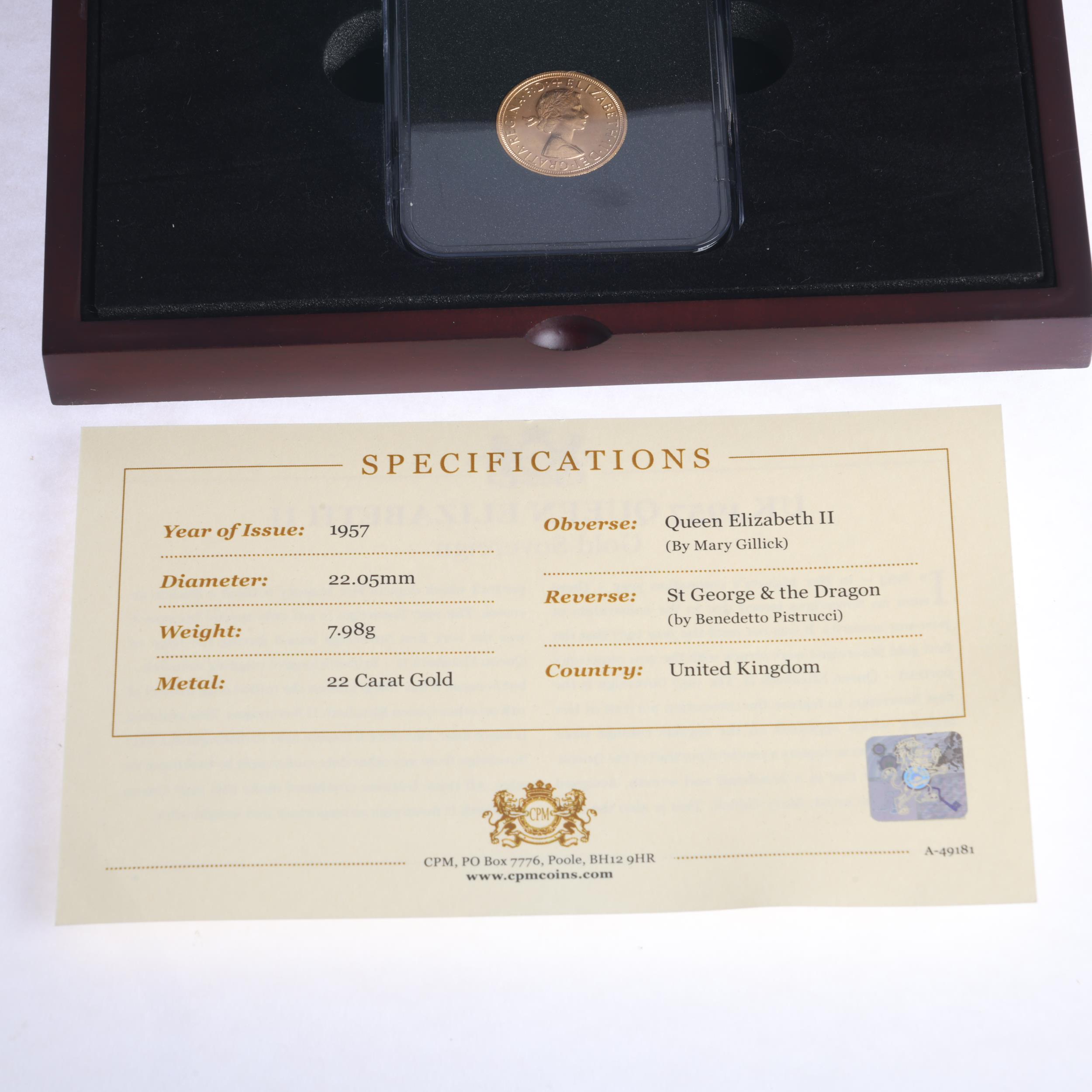 An Elizabeth II 1957 gold full sovereign coin, slabbed with ...