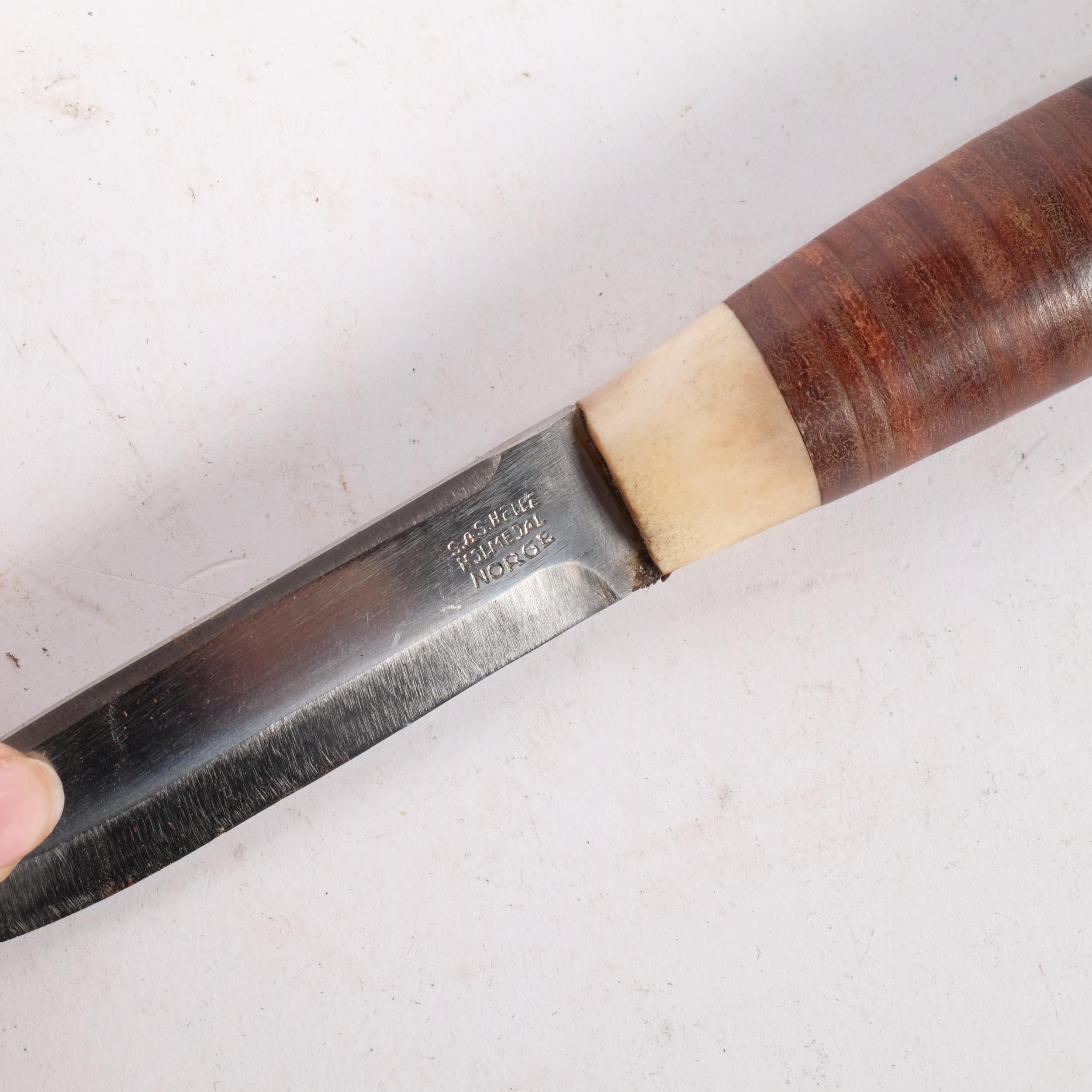 A Norwegian hunting knife, with bone walnut turned handle, blade marked ...