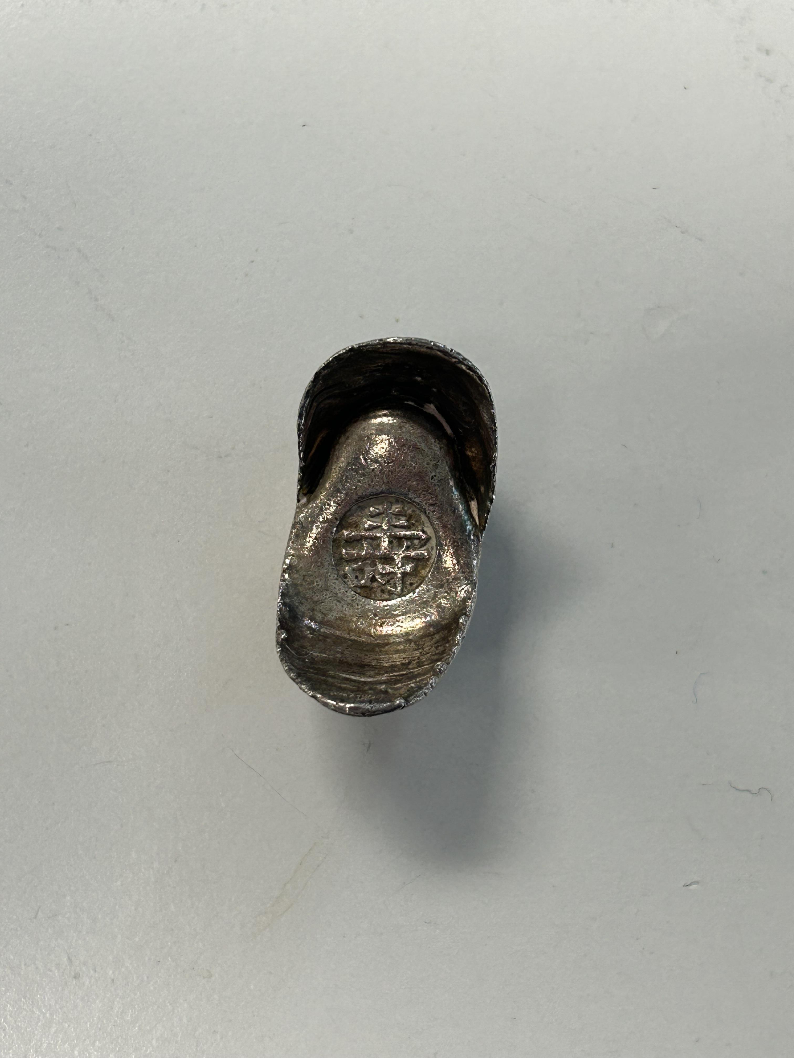 Four 19th century Chinese silver sycee ingots three boat shaped with ...