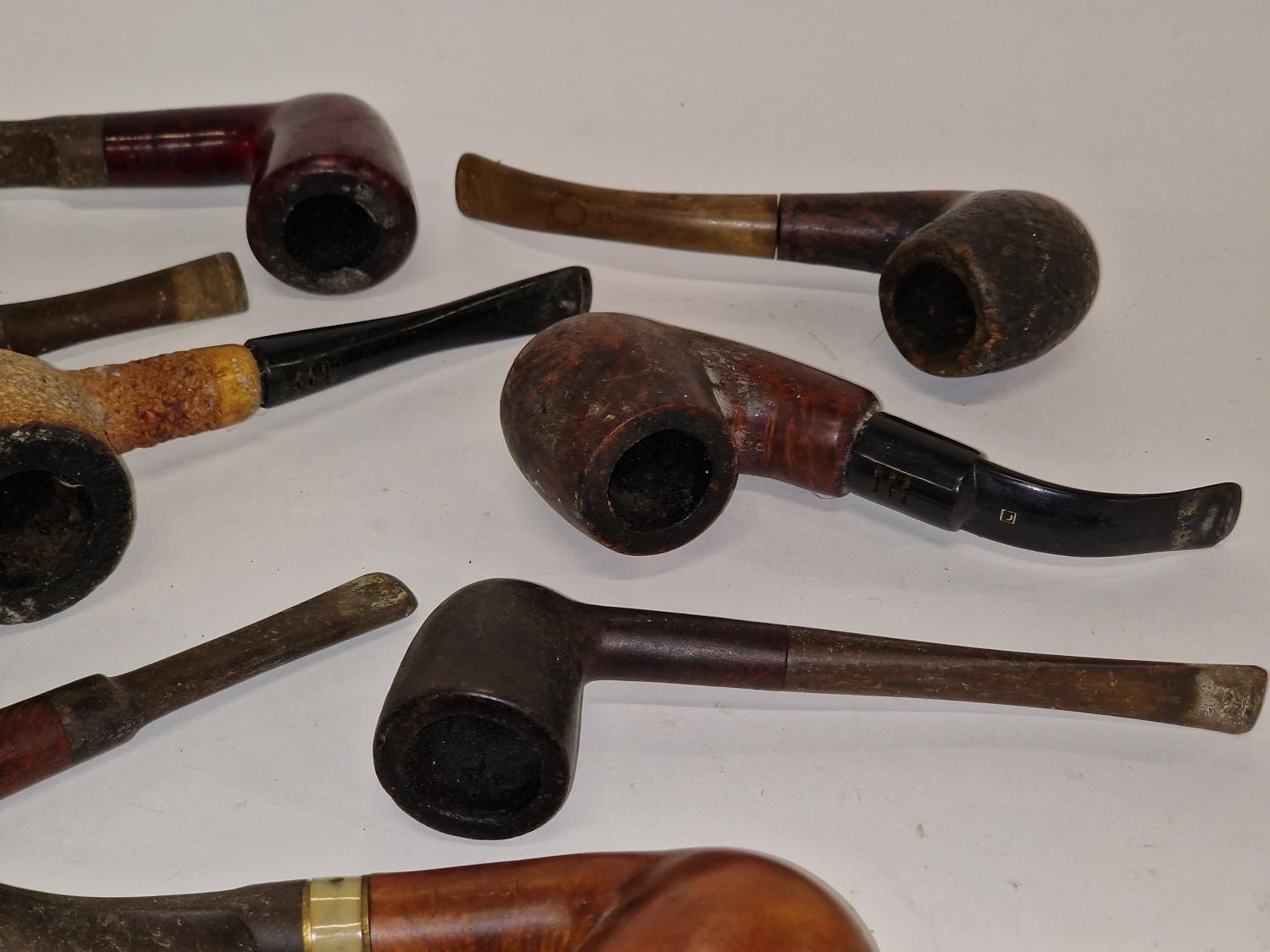 A collection of vintage smokers pipes.