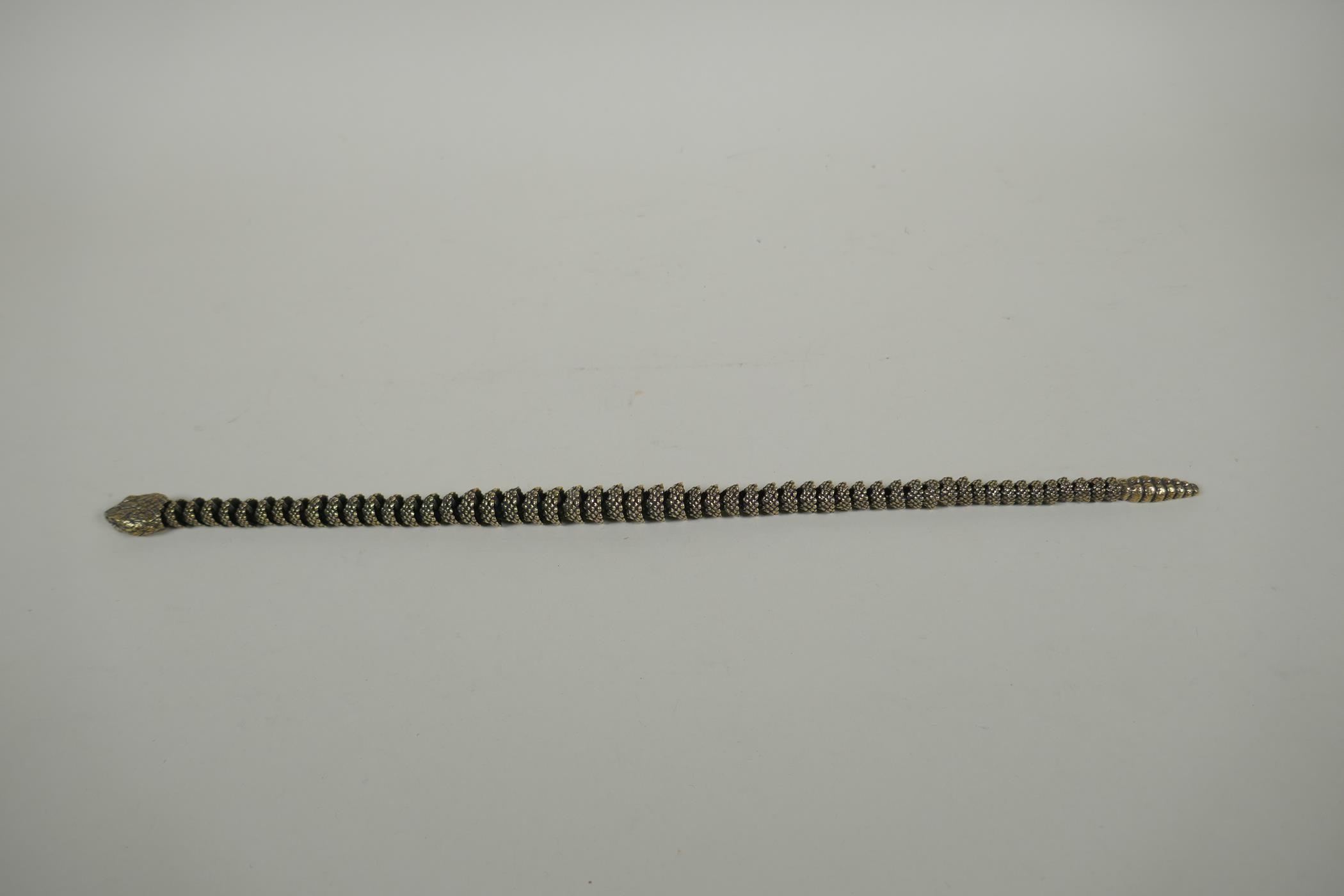 A Japanese Jizai style articulated polished bronze okimono snake, 40cm long