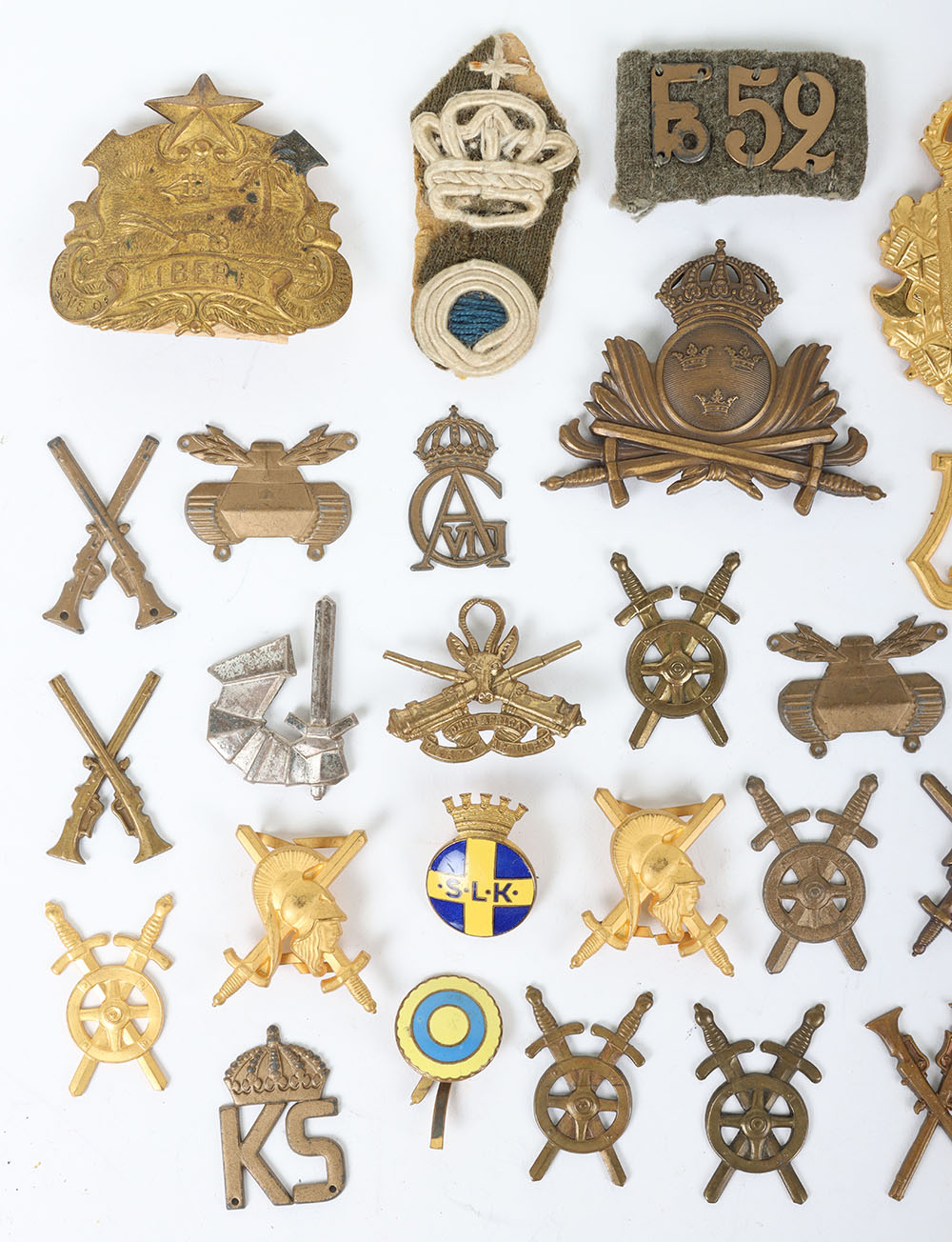 Job lot of mainly Swedish badges. Lot includes Swedish Police cap badge ...
