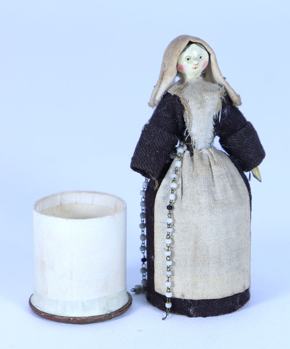 A sweet miniature painted wooden Grodnertal doll dressed as a Nun with ...