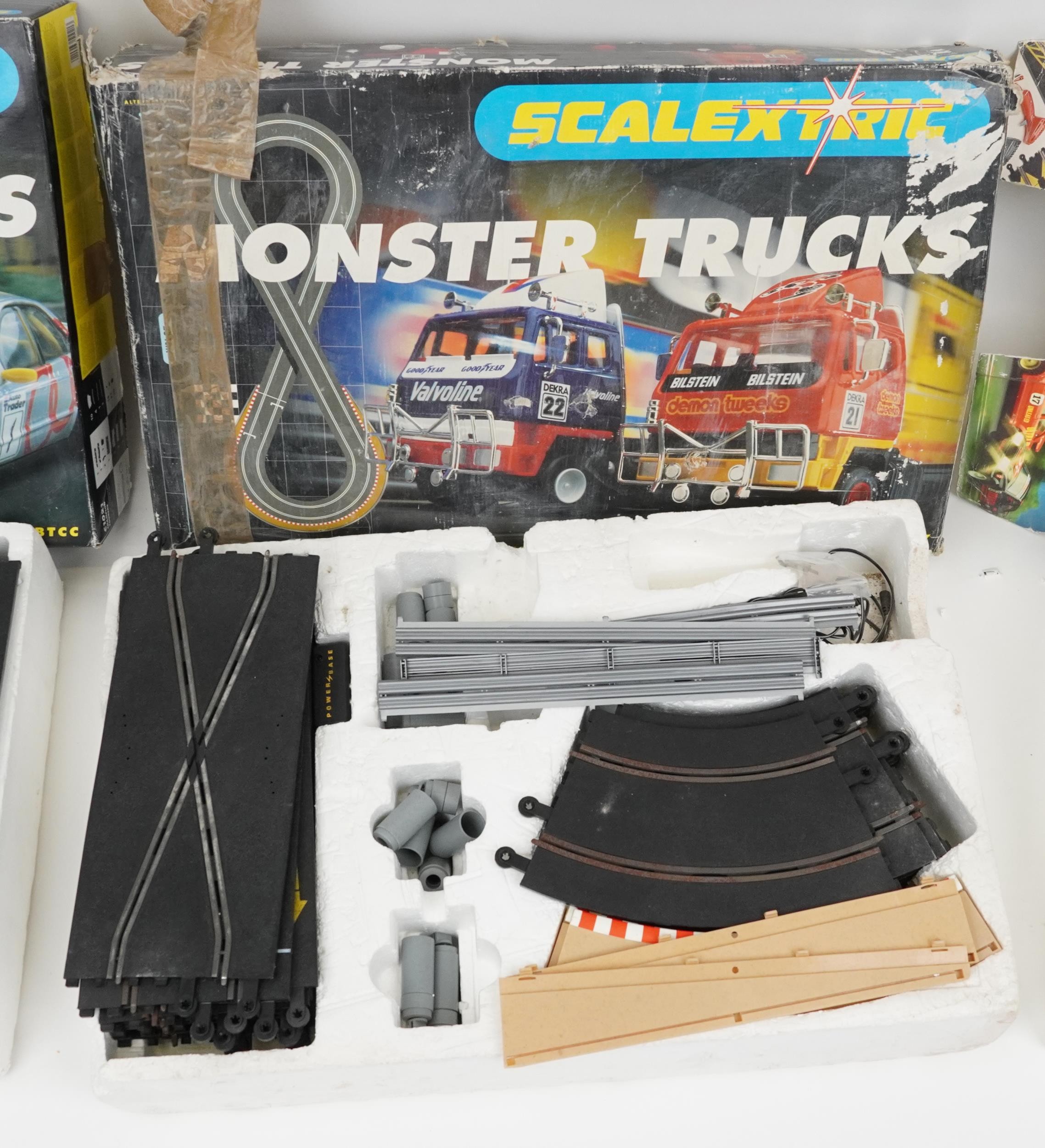Three Scalextric racing sets with boxes comprising Champion Tourers ...