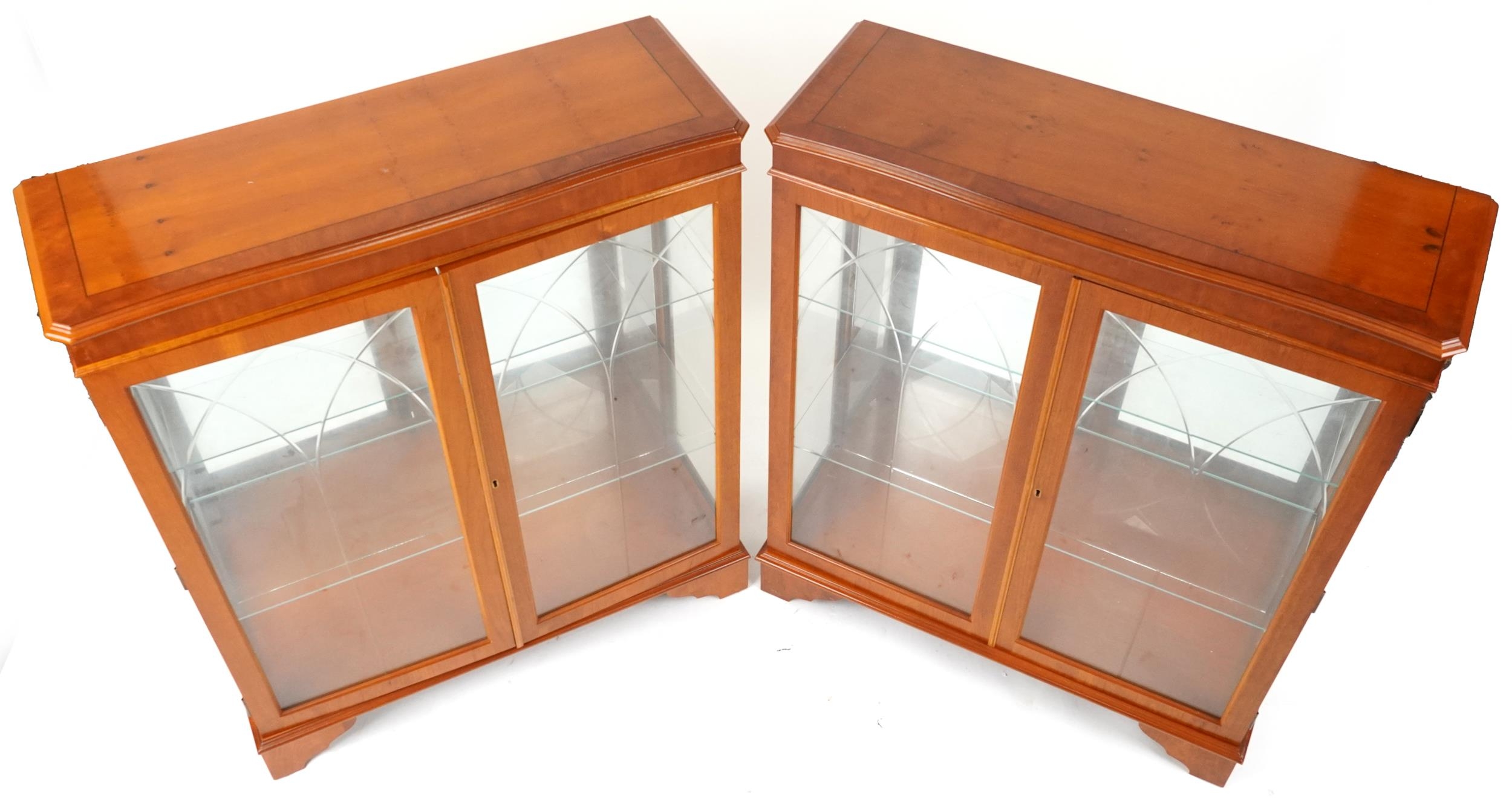 Pair of inlaid yew wood display cabinets, each fitted with two ...