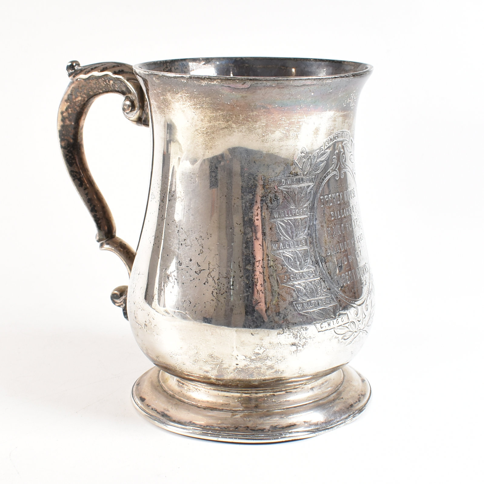A George III hallmarked silver tankard. The tankard of baluster form ...