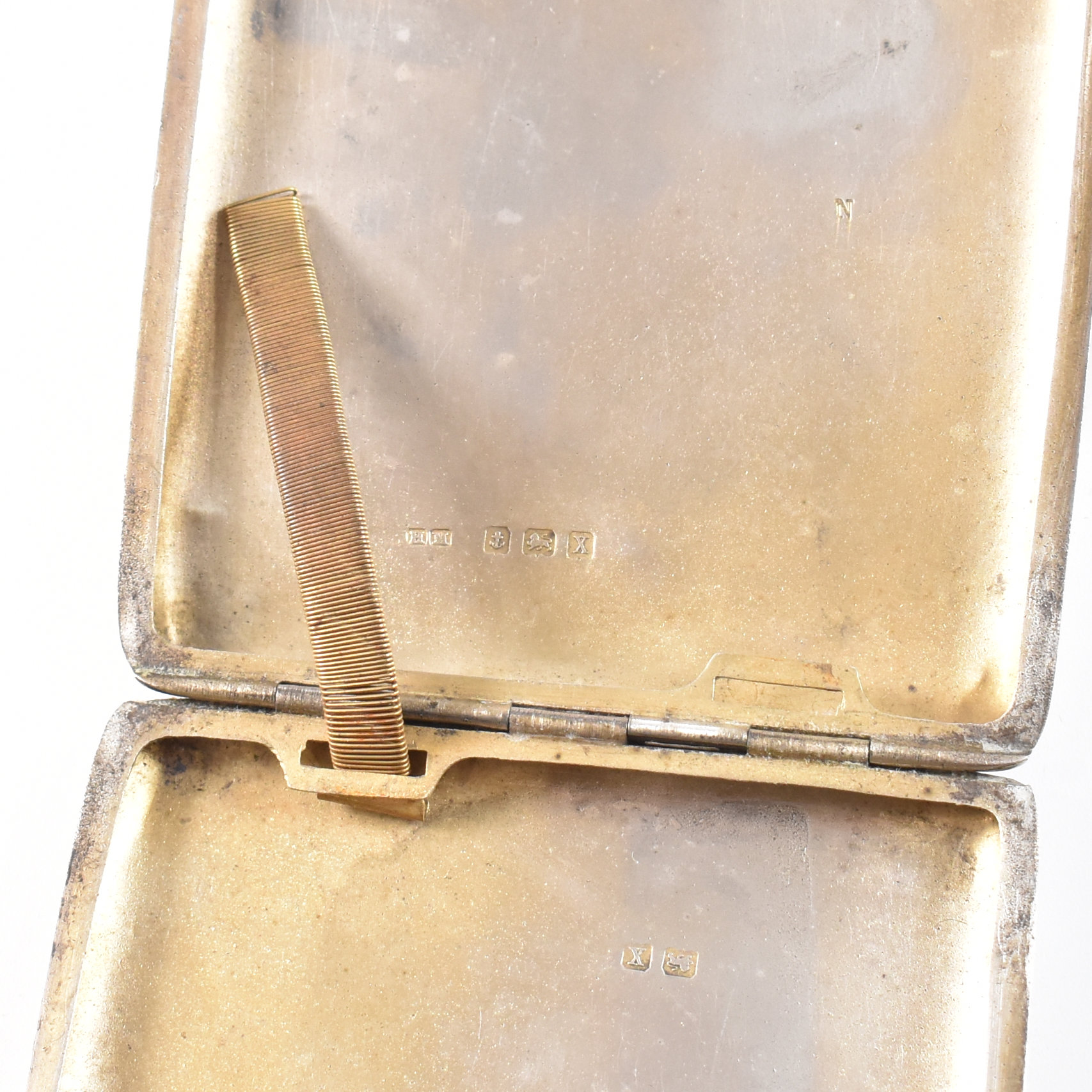 Two hallmarked silver cigarette cases. The lot to include a George VI ...