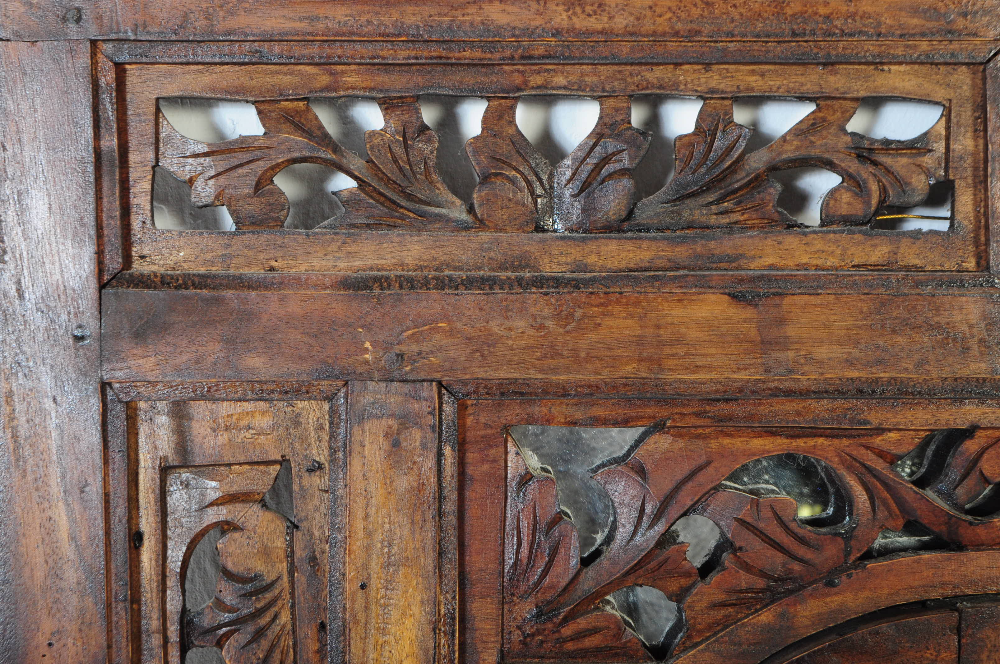 A 20th century Anglo-Indian colonial hardwood fretwork carved and ...