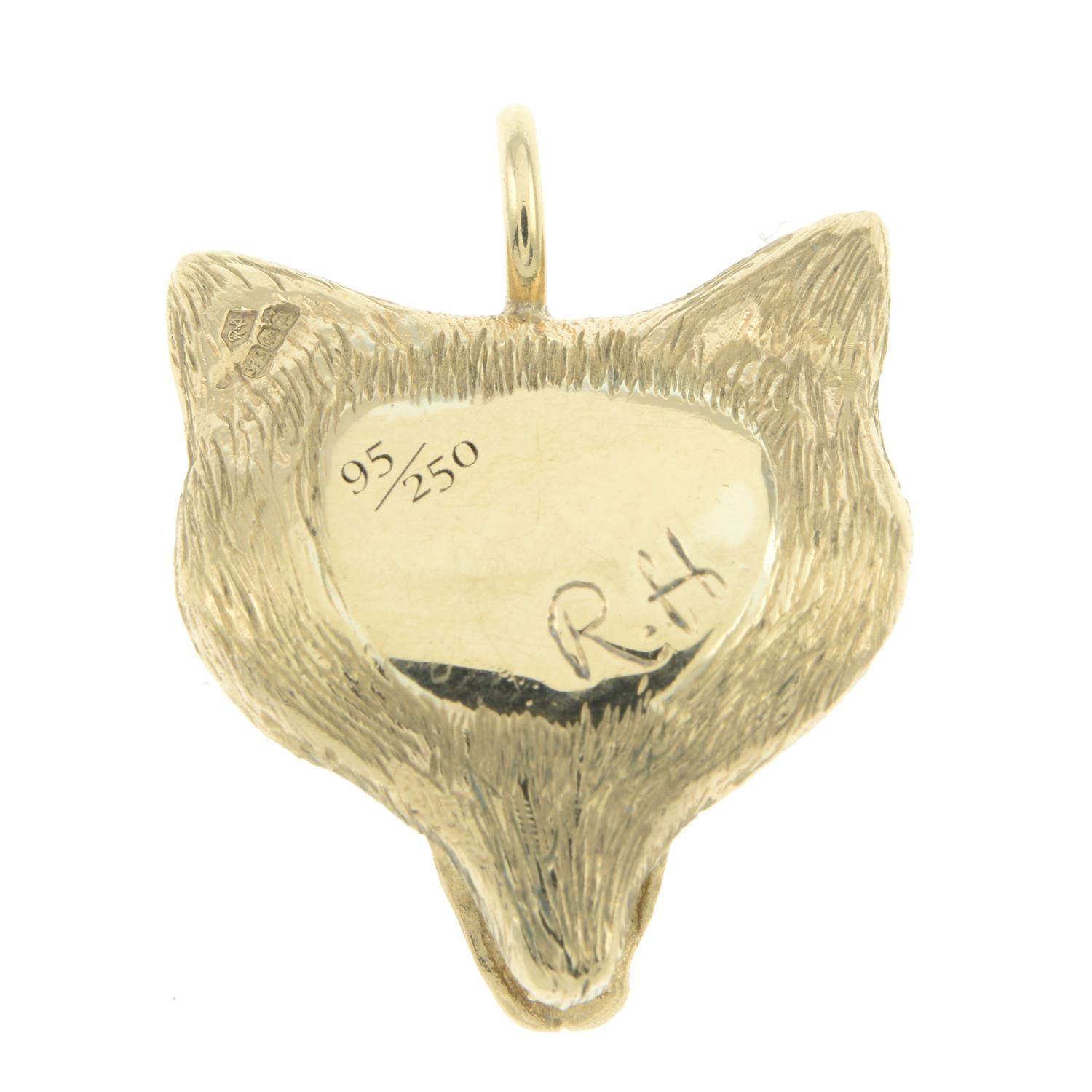 A 9ct gold fox head pendant, with synthetic ruby eye detail.Hallmarks ...