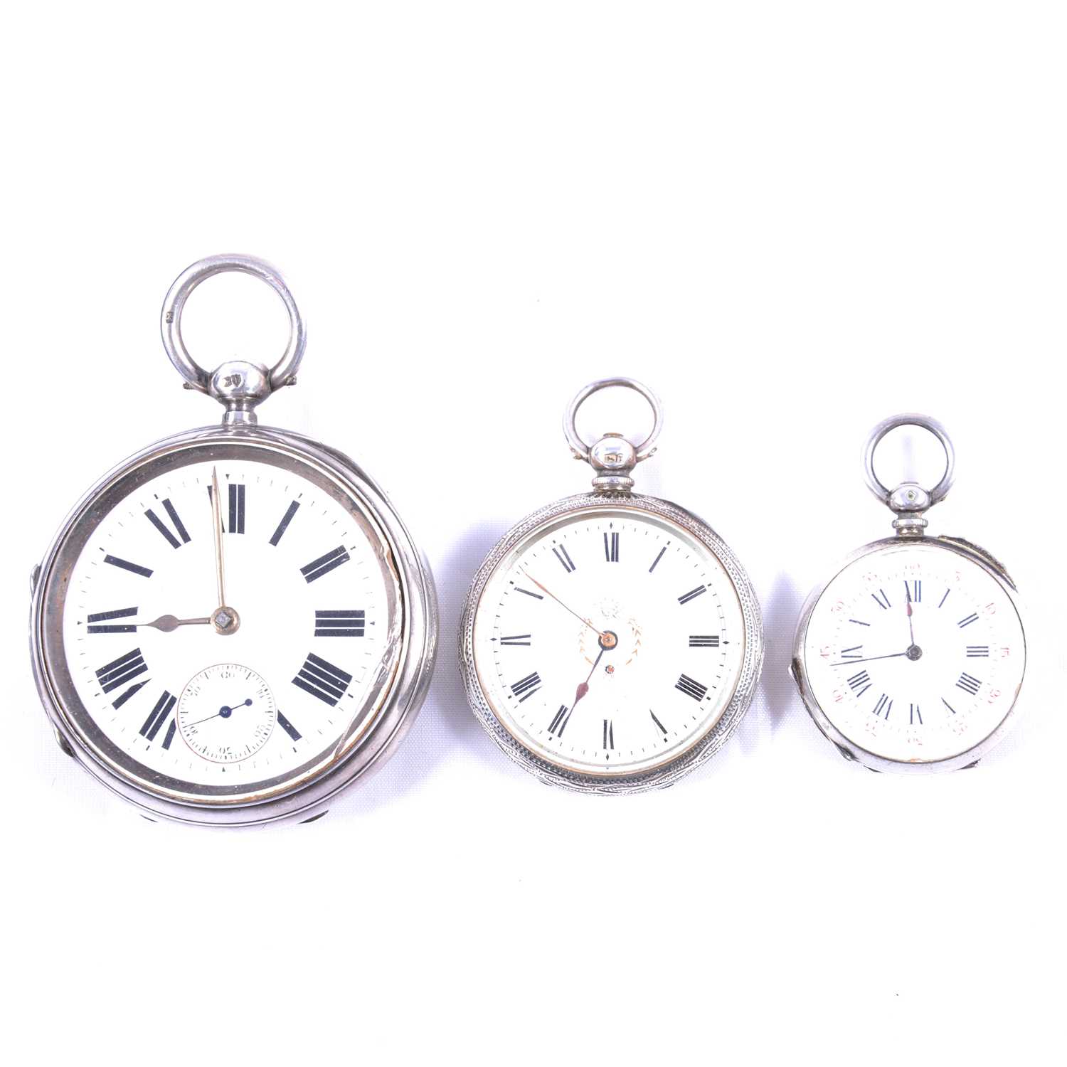 A silver open face pocket watch and two fob watches, a silver open face ...