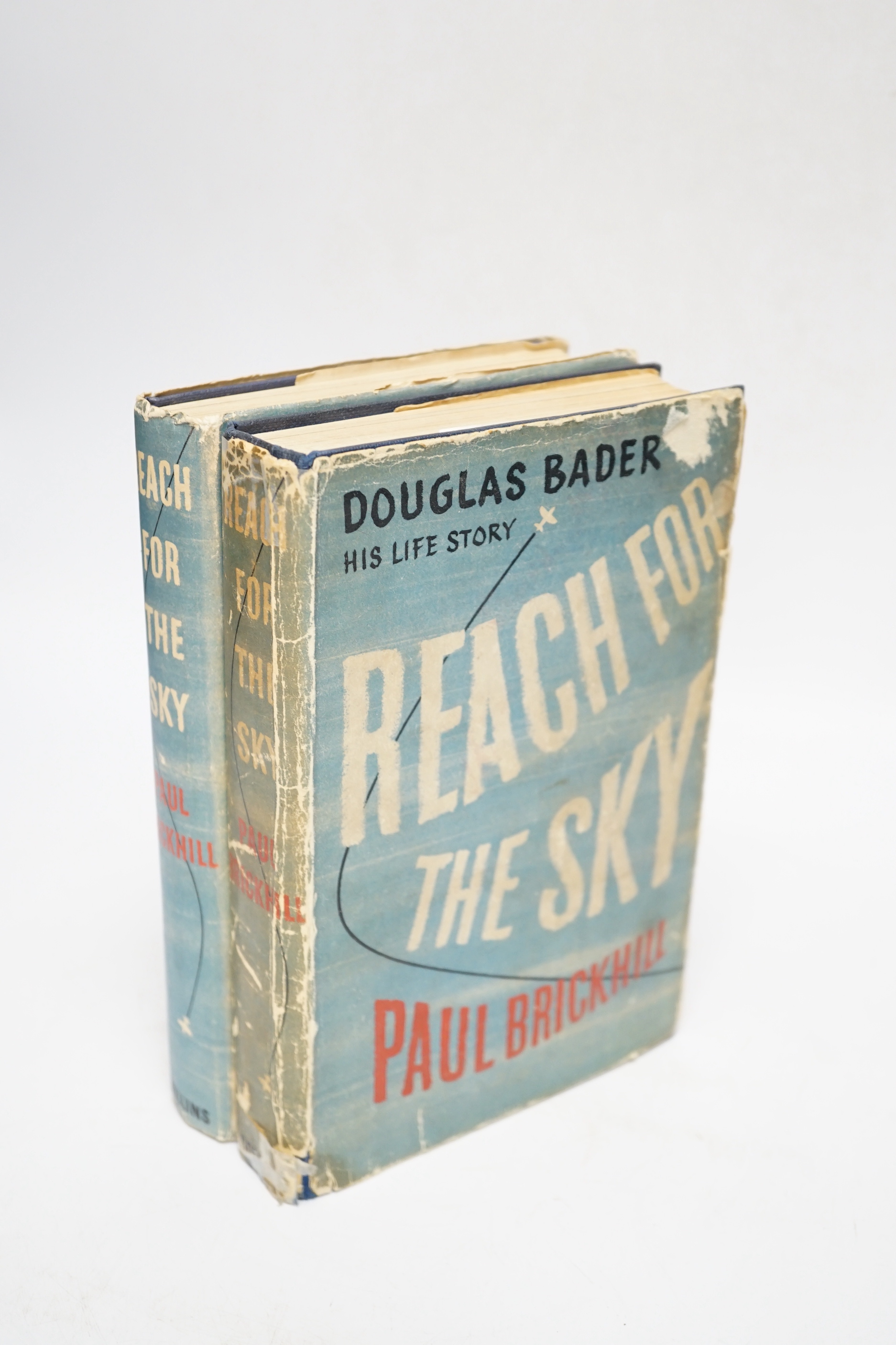 Two copies of Reach for the Skies by P Brickhill, one autographed by ...