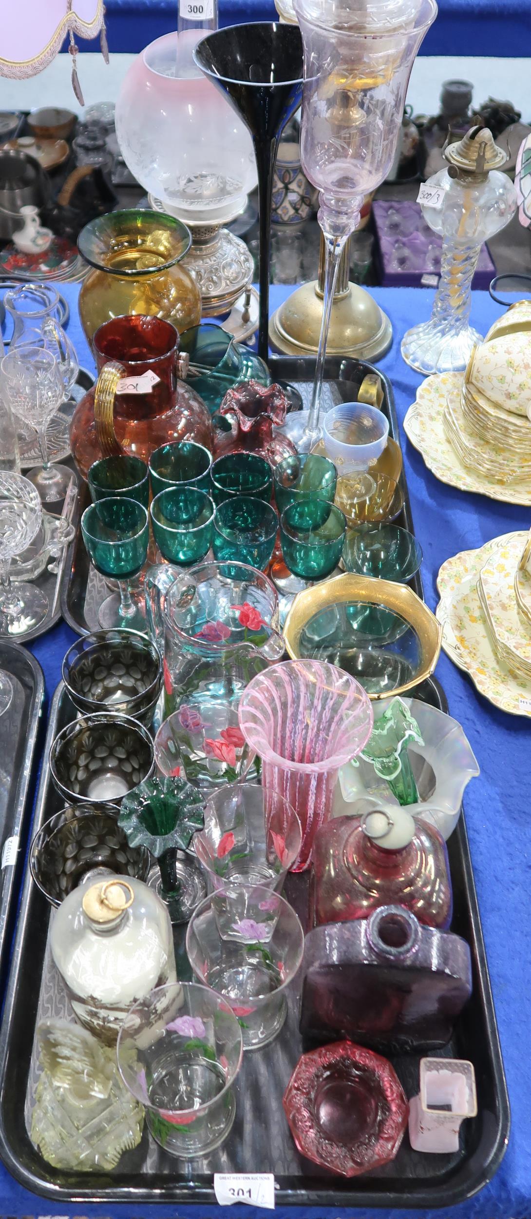 A collection of coloured glass including eight drinking glasses with ...