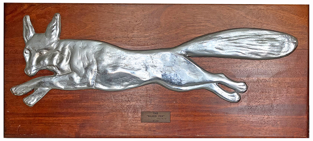 Full size replica steel Silver Fox emblem mounted on a wooden display ...