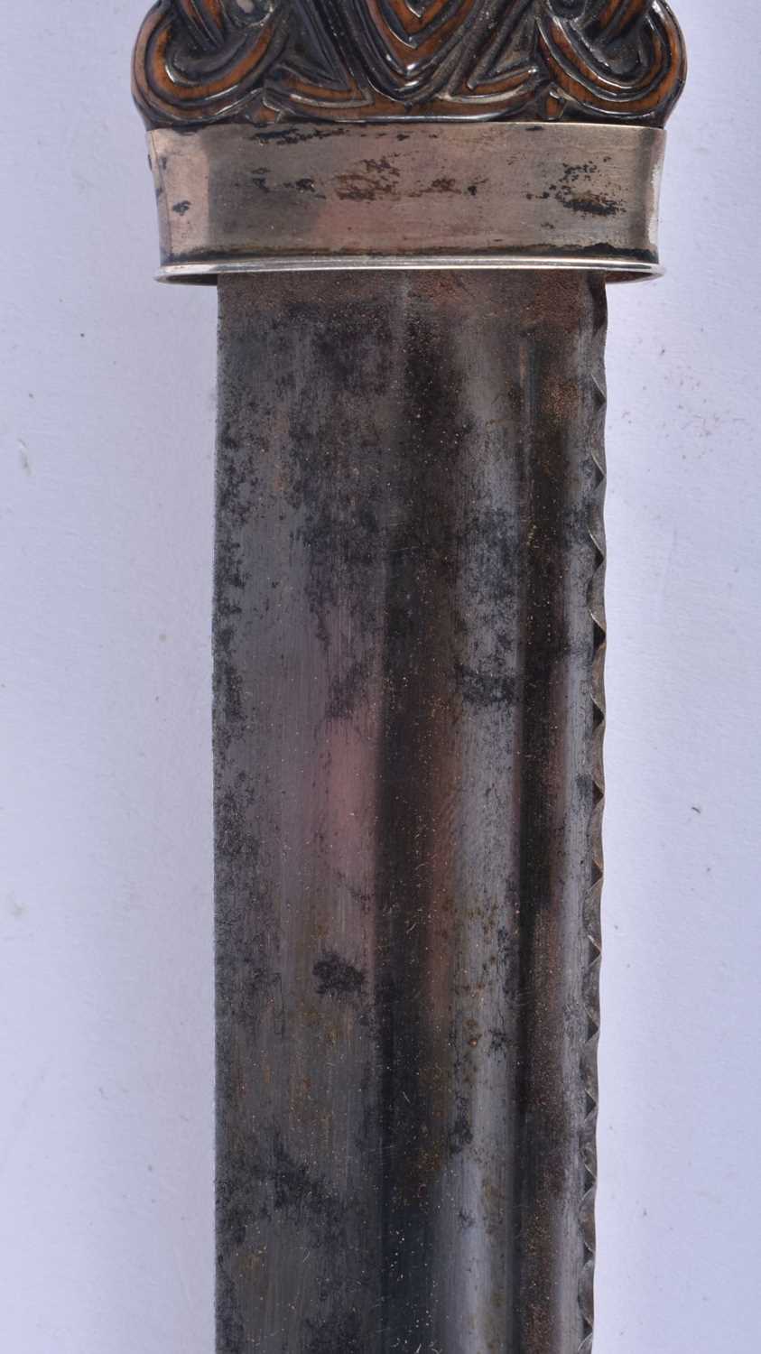 AN ANTIQUE SCOTTISH DIRK DAGGER with white metal mounts. 44 cm long.