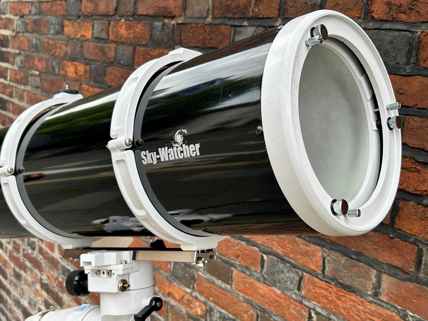 A Sky-Watcher telescope with 8" lense, bears label 'D = 200mm F ...