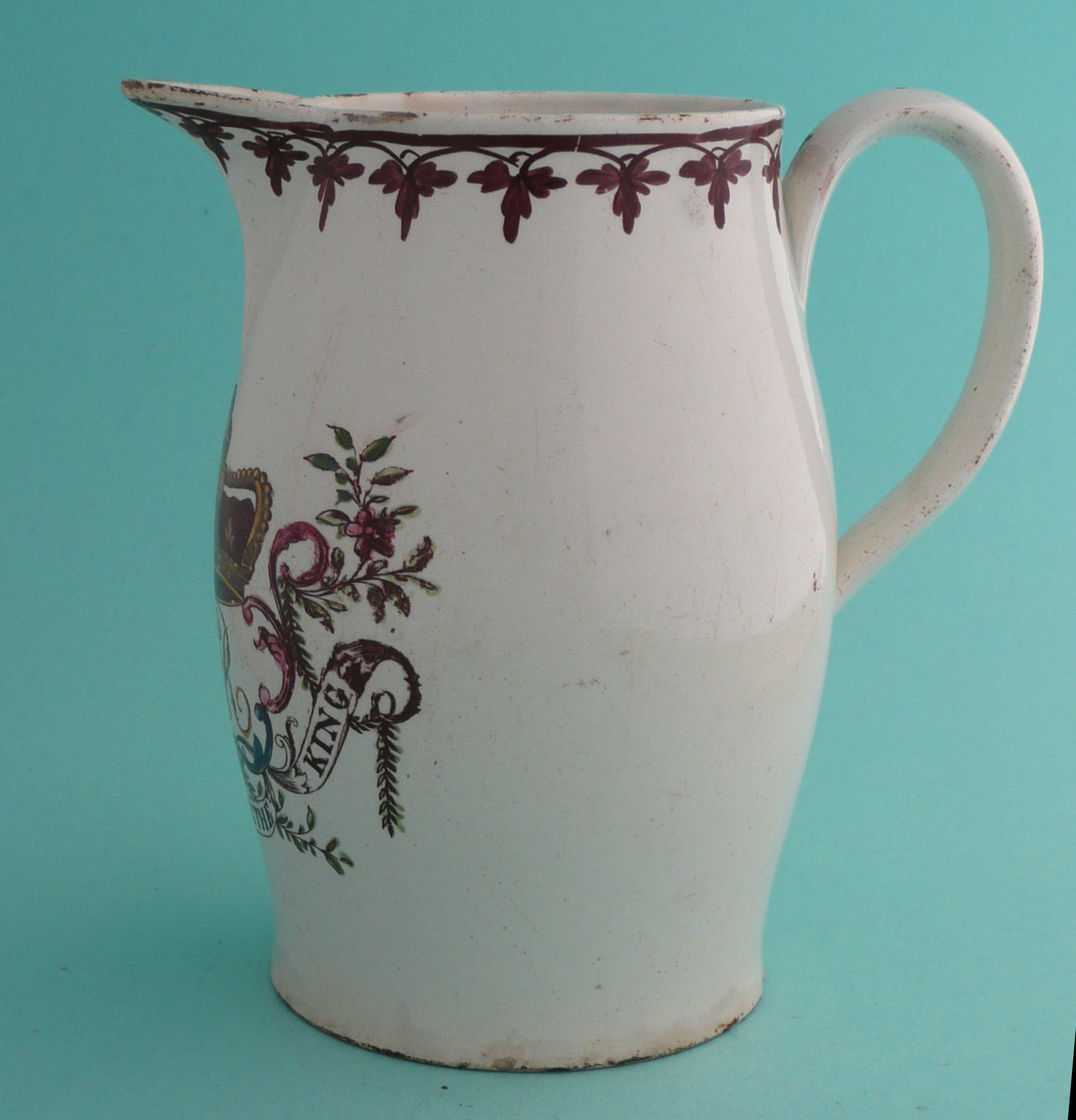 George III: a creamware jug printed in brown and attractively decorated ...