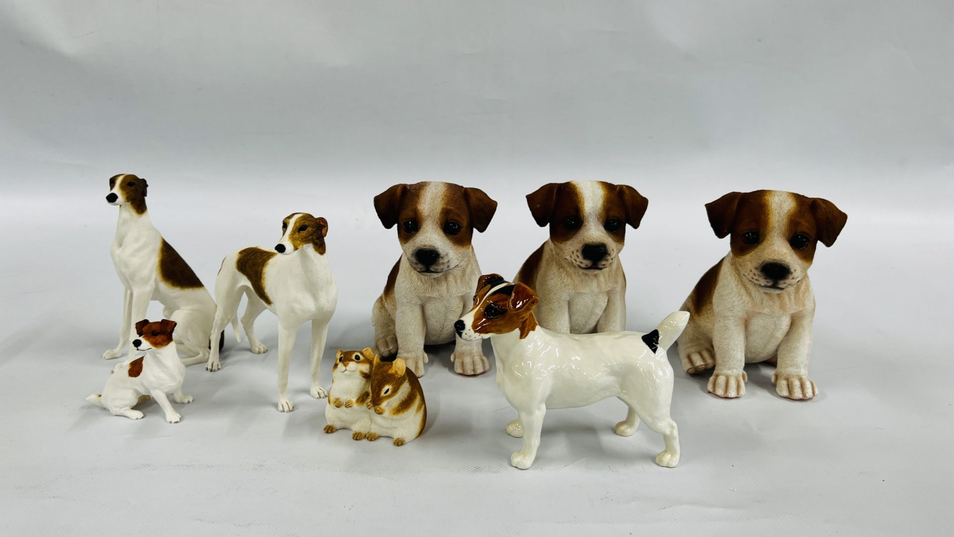 A BESWICK MODEL OF A JACK RUSSELL TERRIER L 15.5CM X H 11.5CM + 3 RESIN ...
