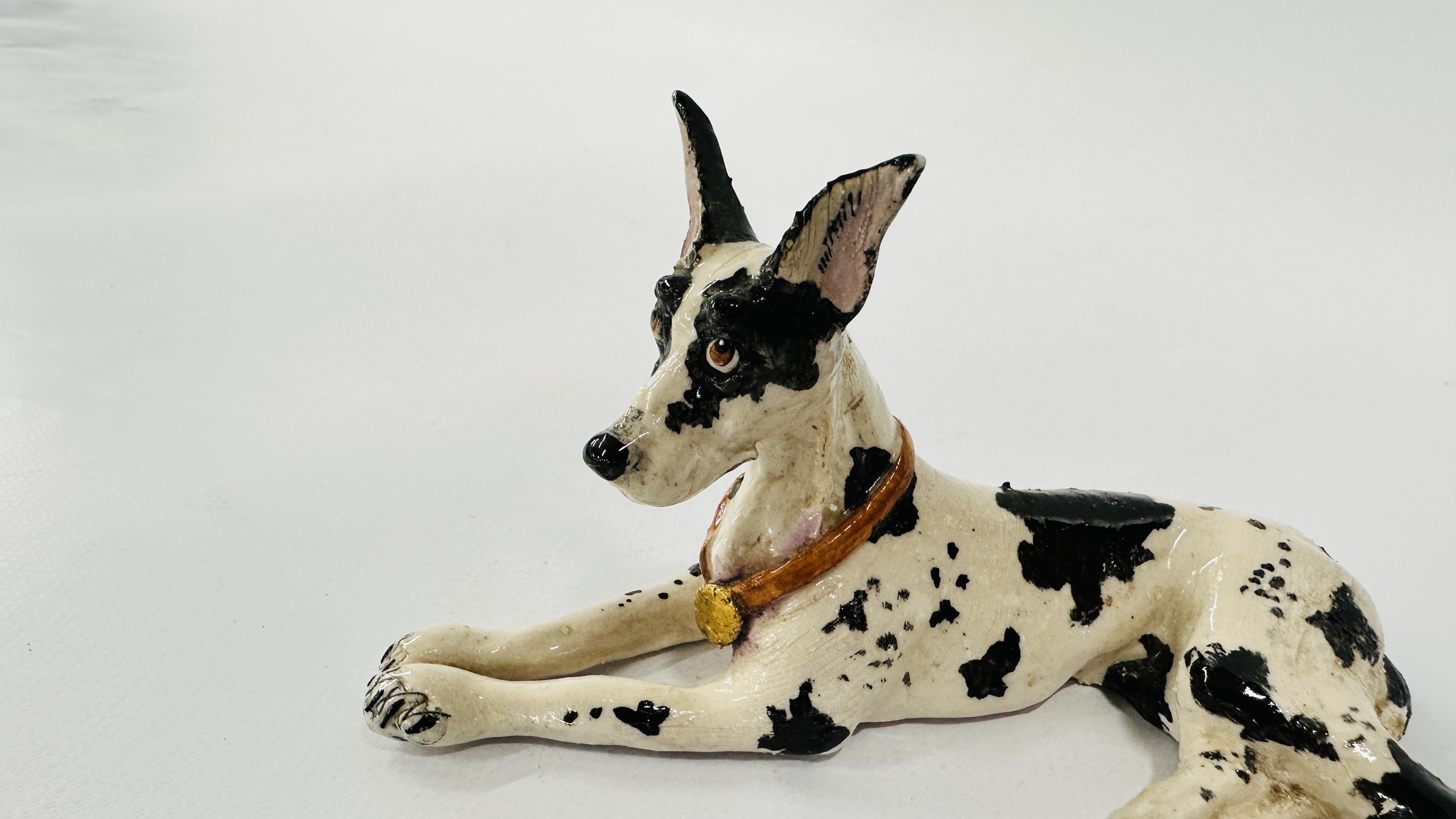 A STUDIO POTTERY STUDY OF A GREAT DANE SIGNED BASIL MATTHEWS.