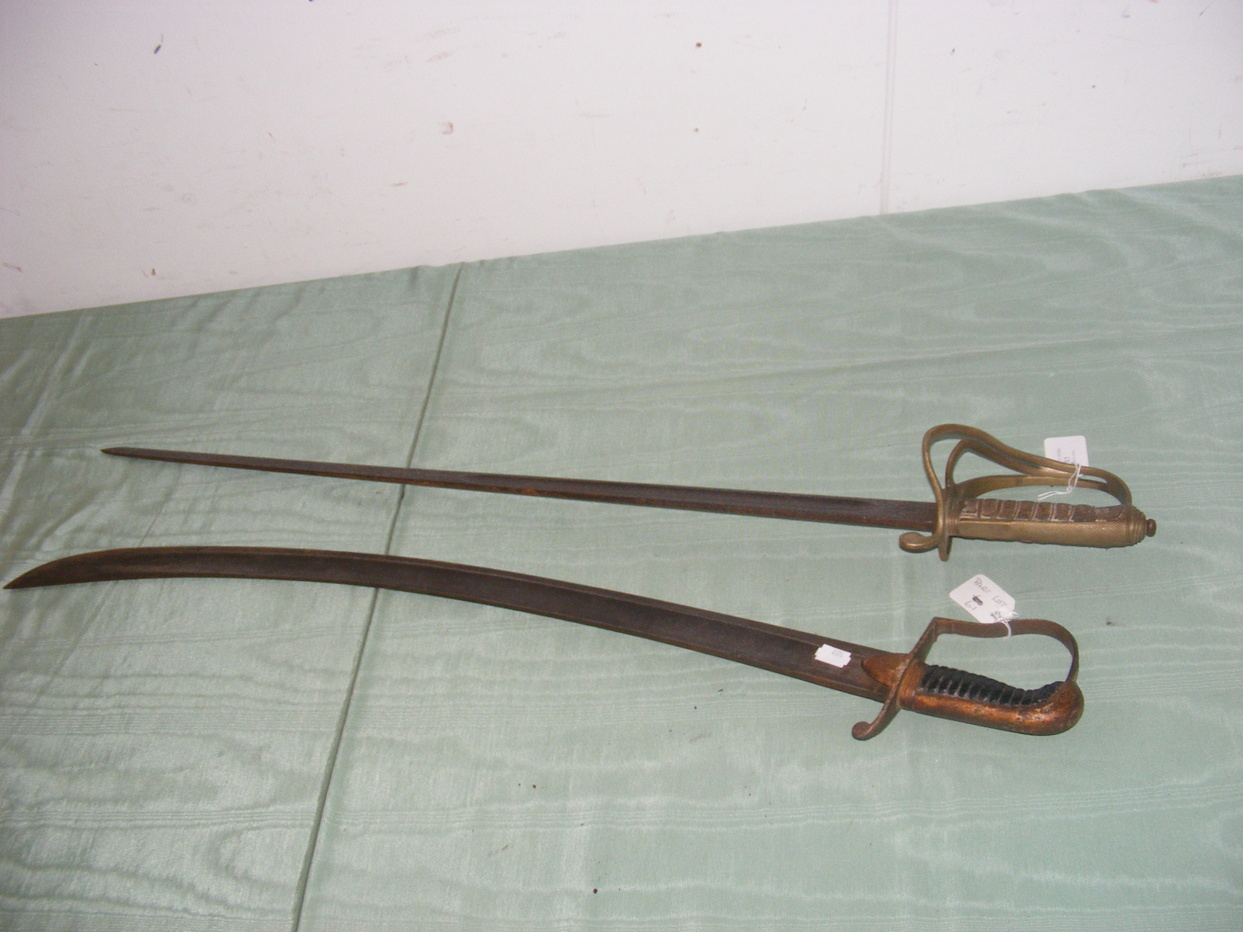 An antique sword with shagreen grip, together with a curved sword ...
