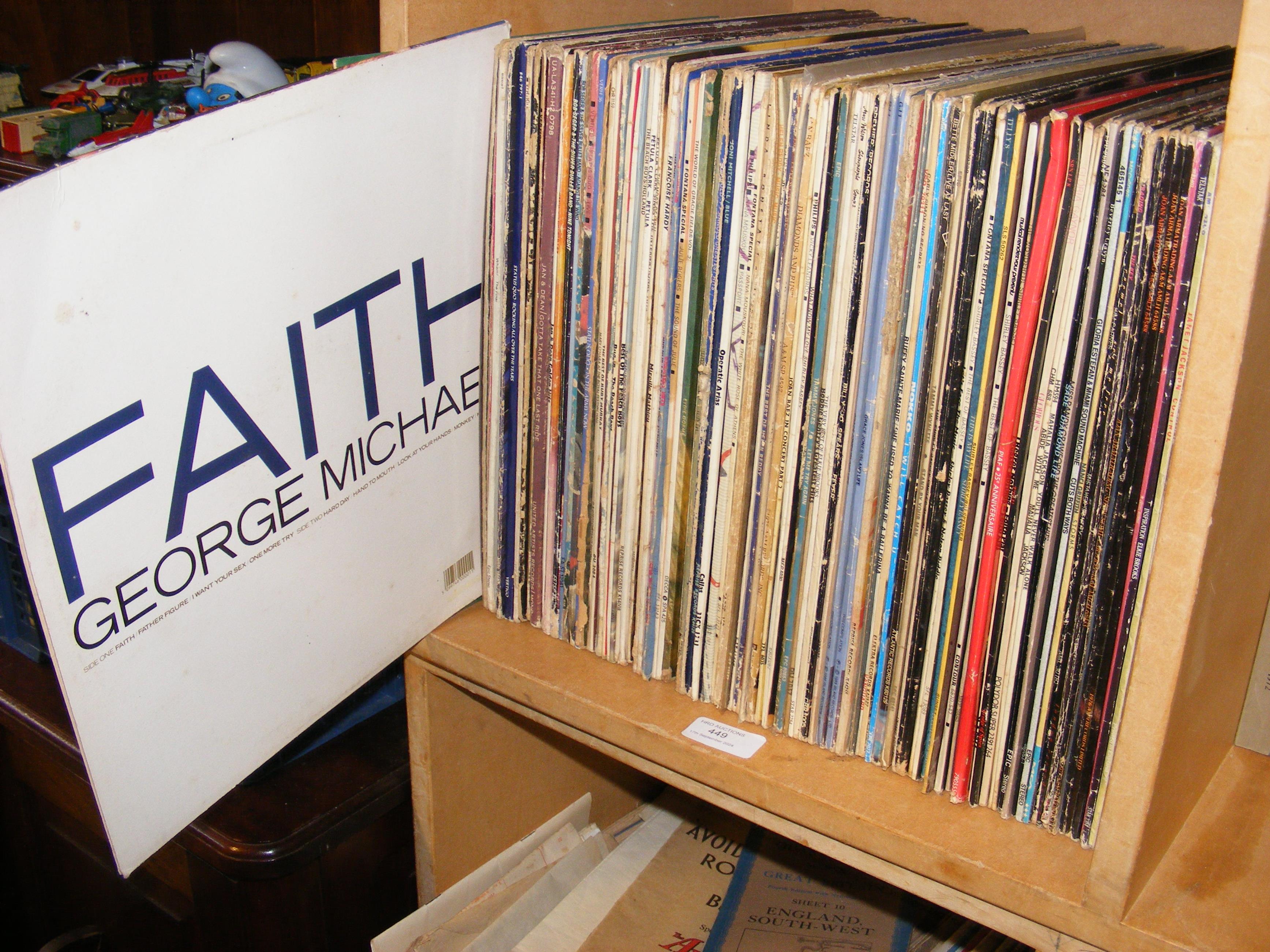 A collection of vinyl LP records, including Status Quo, The Beach Boys ...