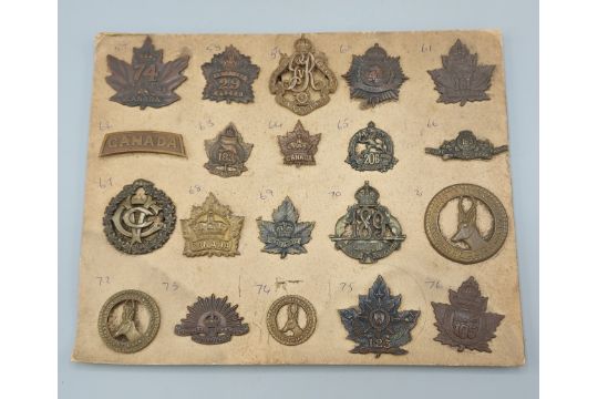 A collection of twenty WWI Canadian cap badges