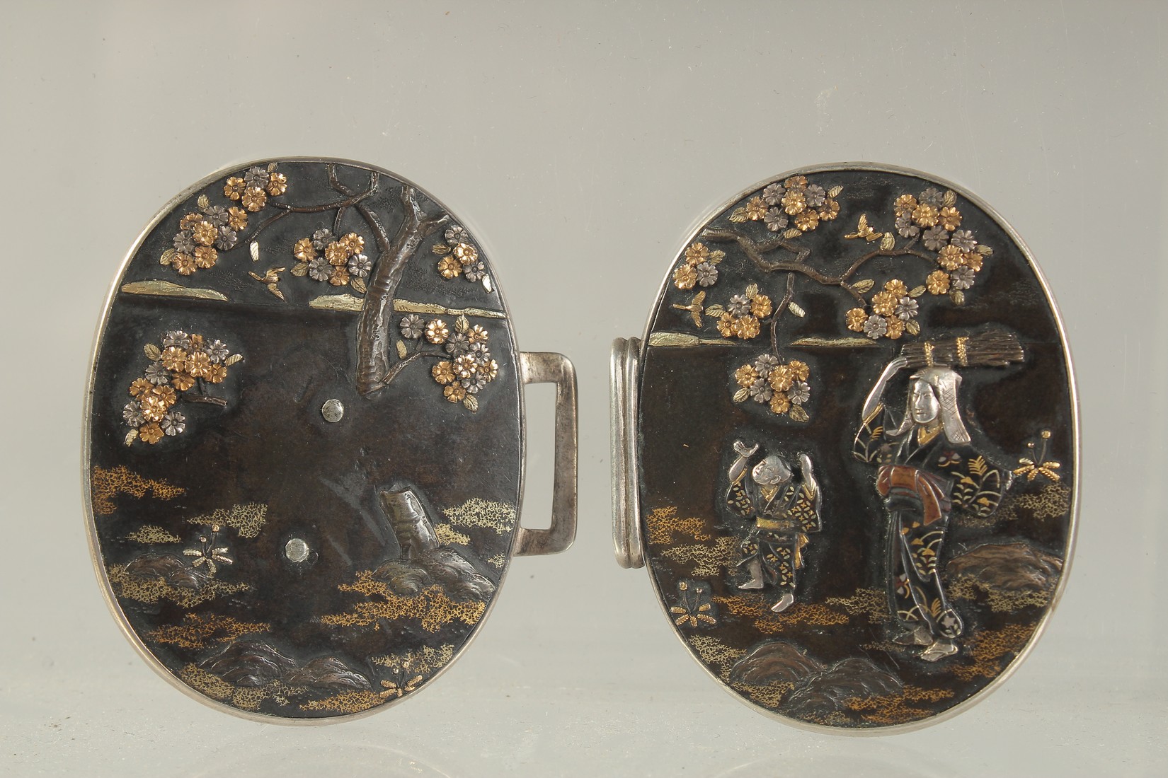 A FINE JAPANESE MEIJI TWO-PART SHAKUDO BELT BUCKLE, each piece of oval ...