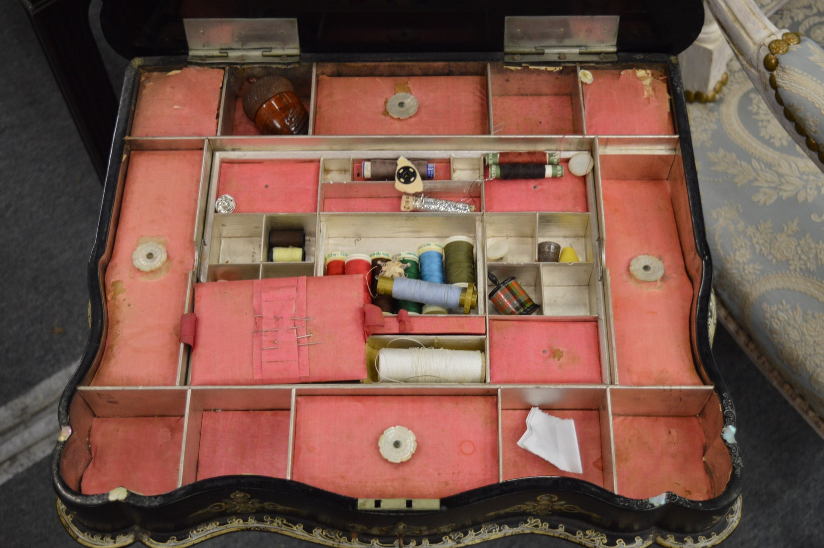 A good Victorian papier mache lacquer sewing table with tripod support.