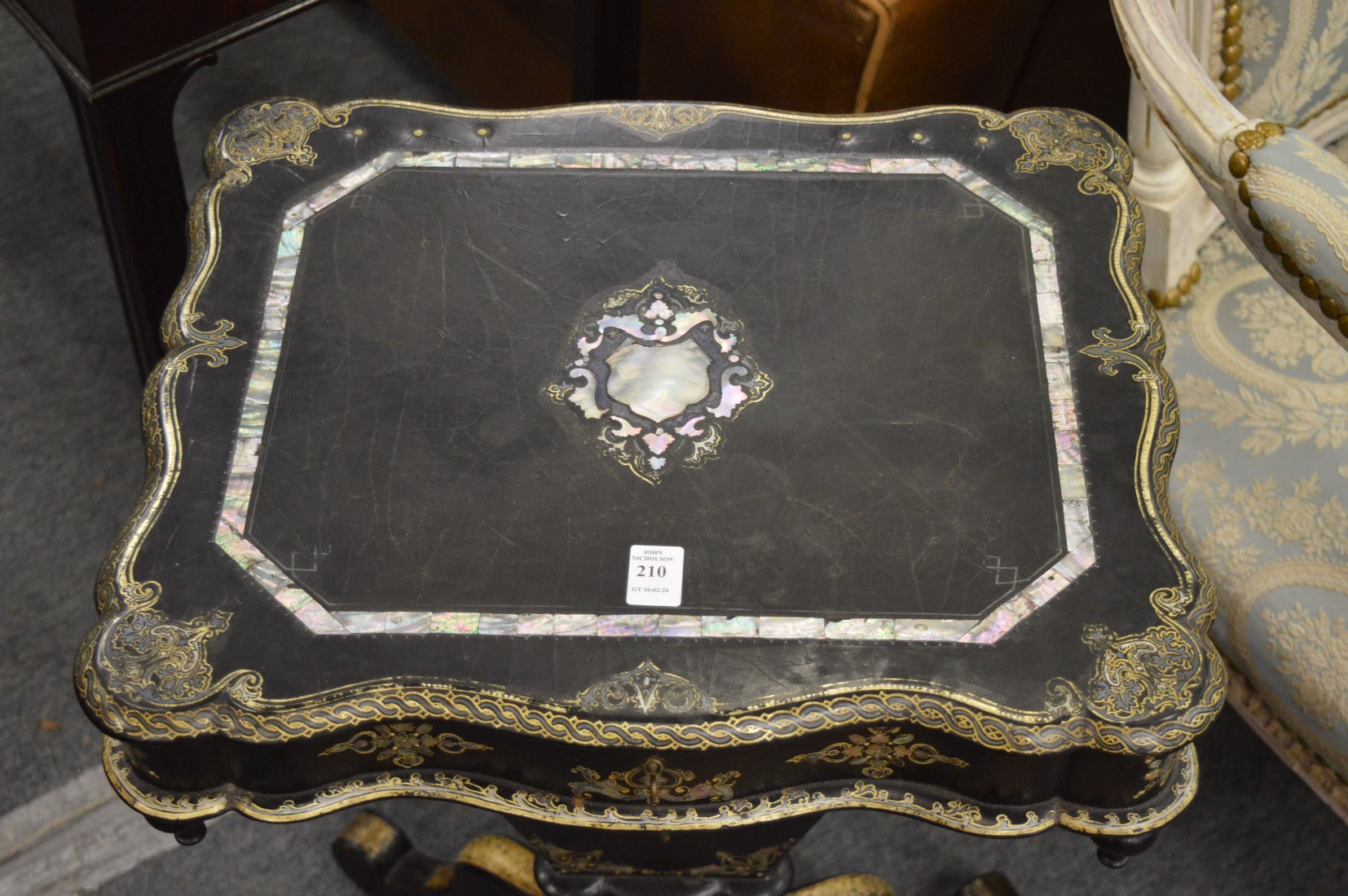 A good Victorian papier mache lacquer sewing table with tripod support.