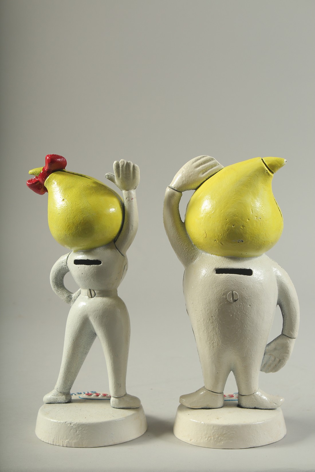 A PAIR OF PAINTED CAST IRON ESSO MONEY BOXES. 9.5ins high.