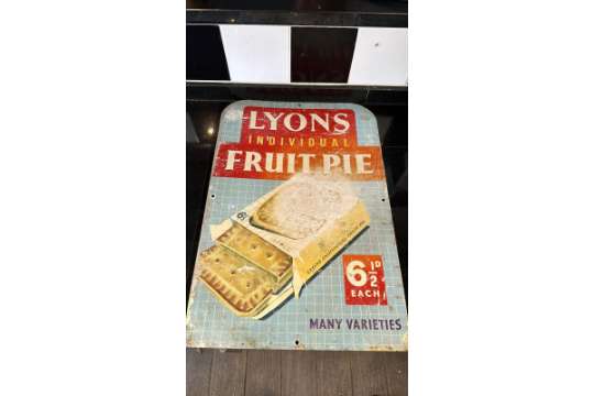 A vintage enamelled advertising sign for Lyons Individual Fruit Pie ...