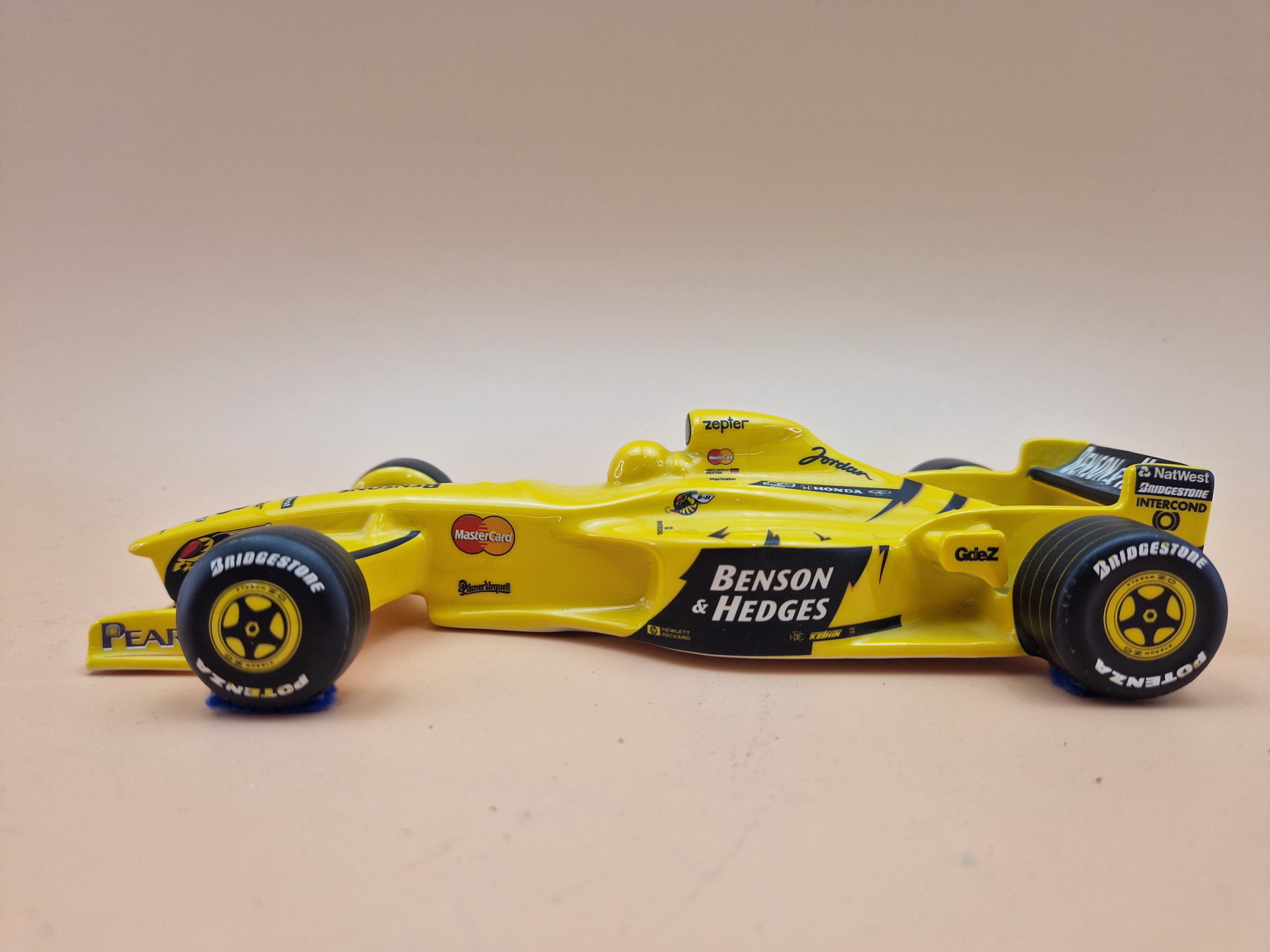 A RARE KARLOVARSKY PORCELAIN FORMULA ONE JORDON RACE CAR
