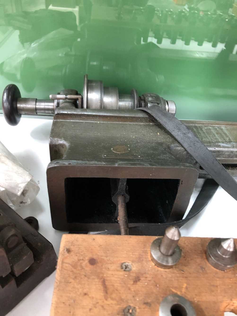 A Mikron lathe complete with a large collection of collets.