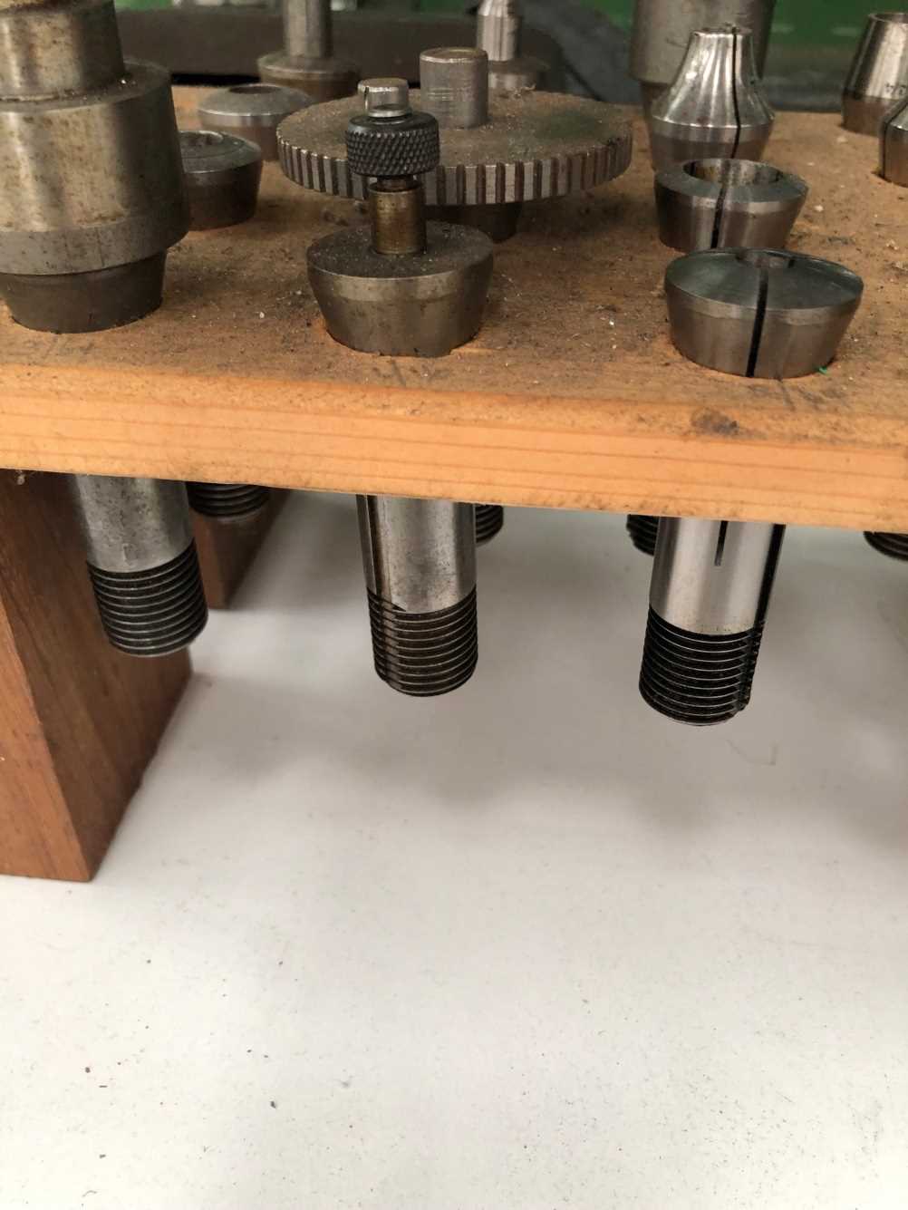A Mikron lathe complete with a large collection of collets.