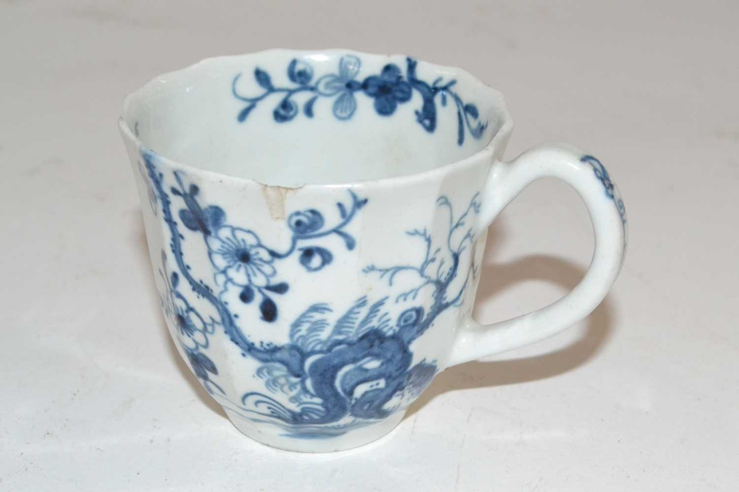 An early Worcester porcelain cup of fluted form painted with the root ...