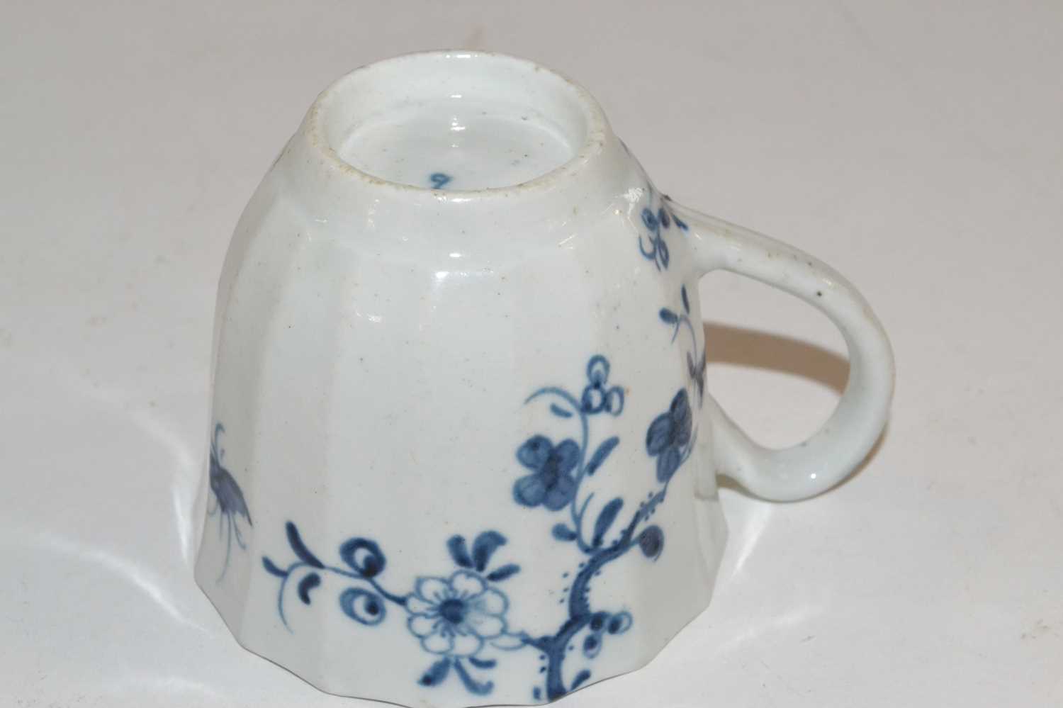 An early Worcester porcelain cup of fluted form painted with the root ...