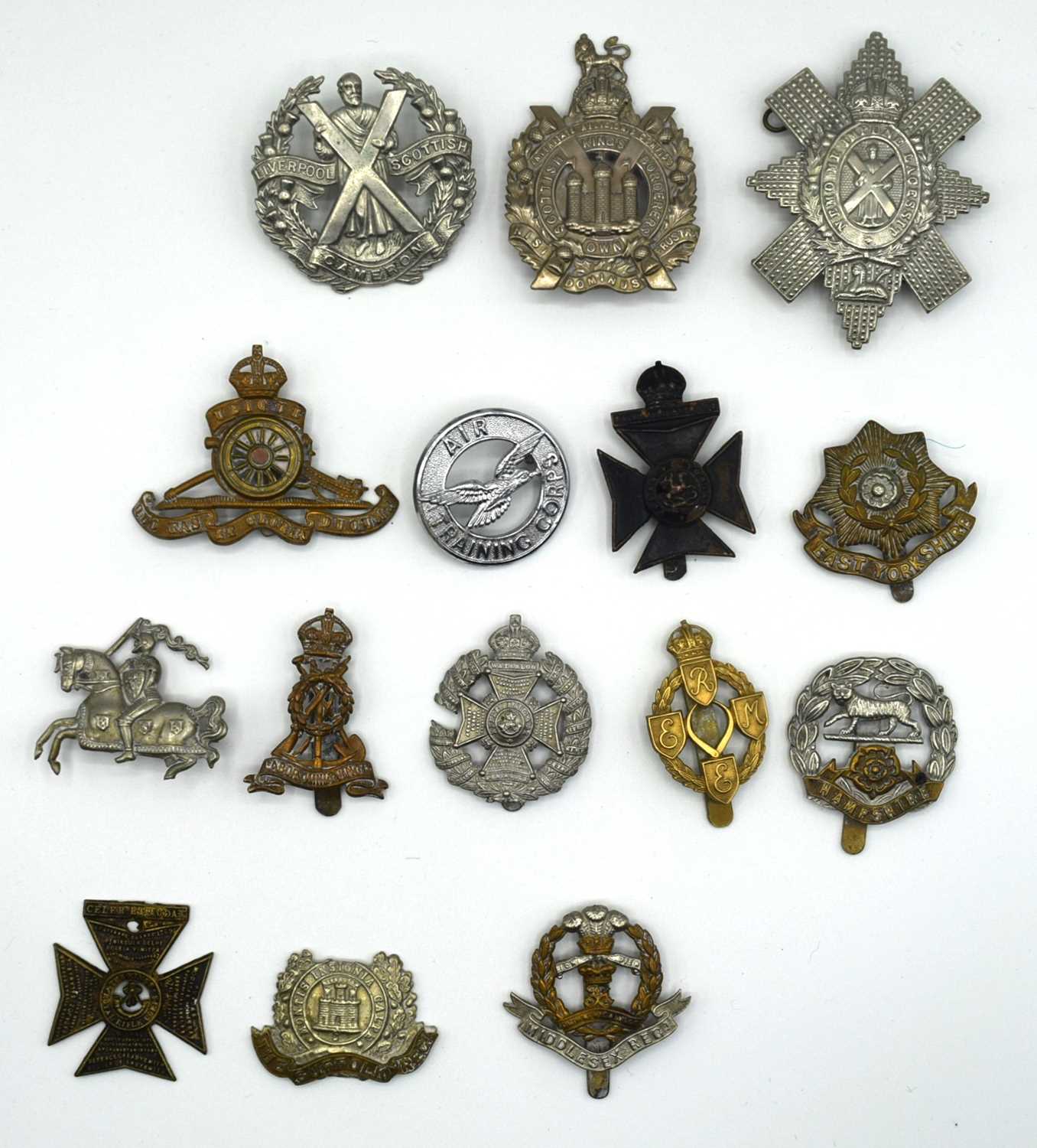 Quantity of 20th Century military cap badges to include 15th (isle of ...