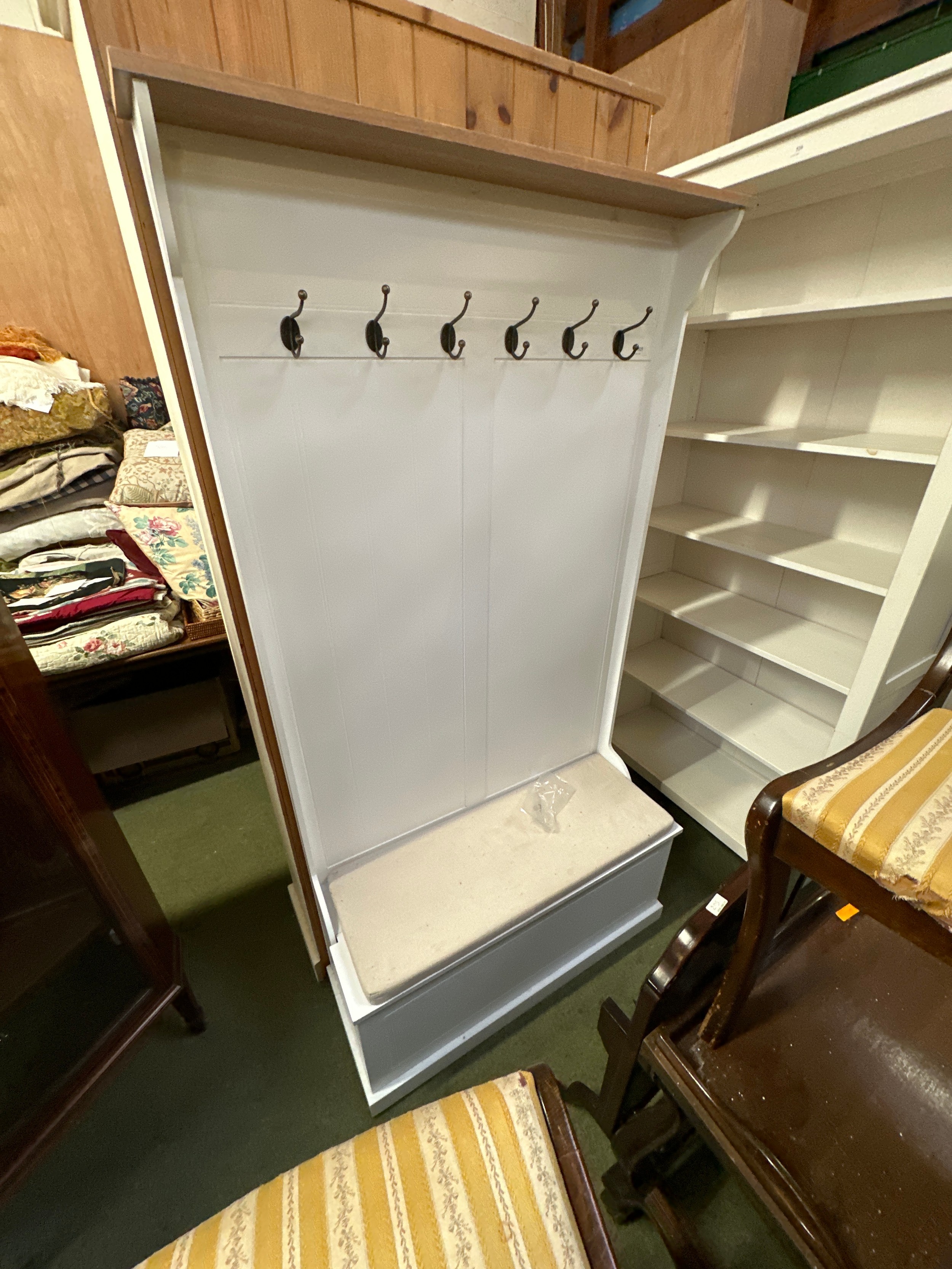 A free standing cream painted hall/boot room stand, with coat pegs and ...