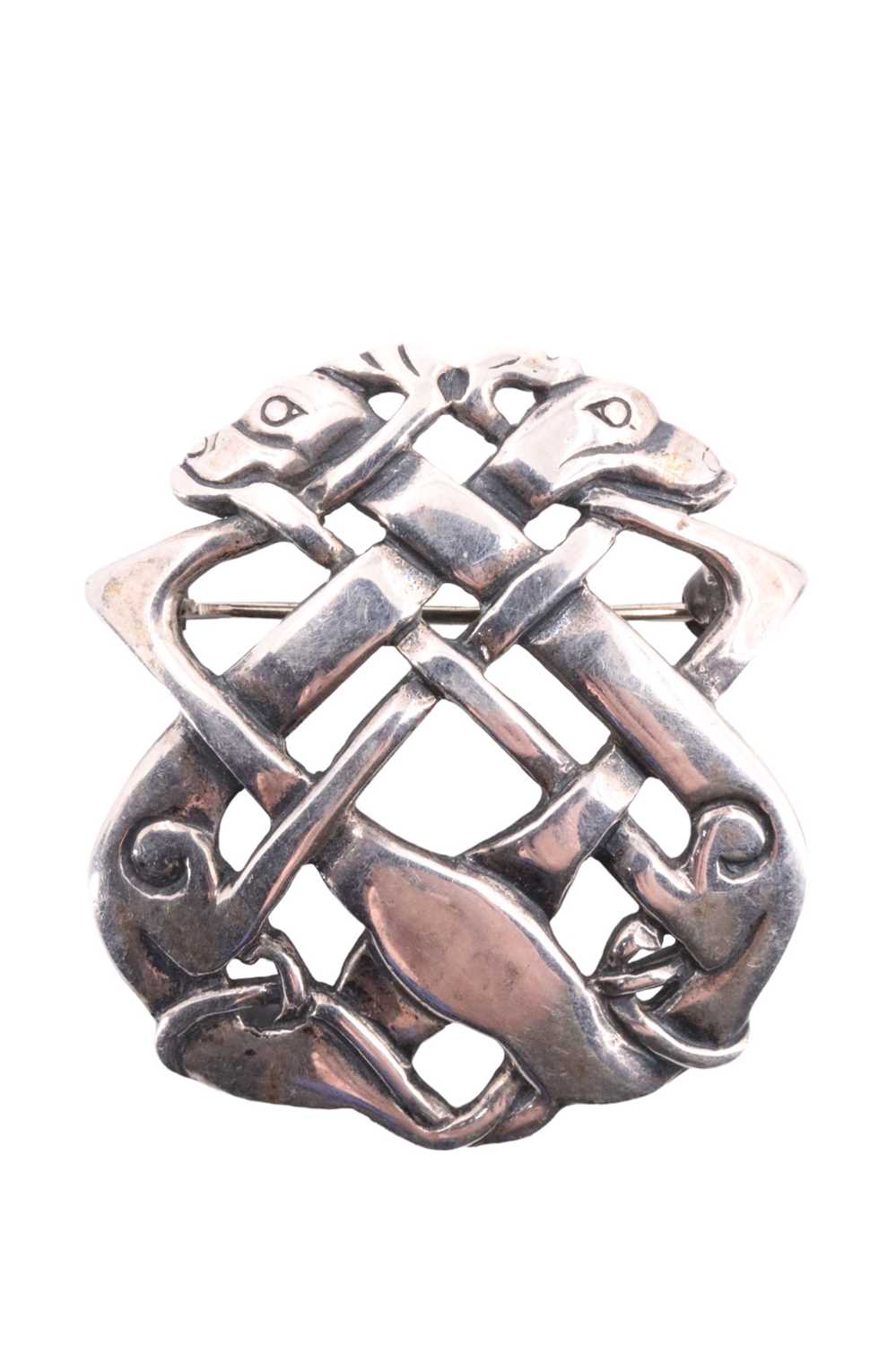 A silver Orkney brooch designed by Malcom Gray, having Celtic beasts ...