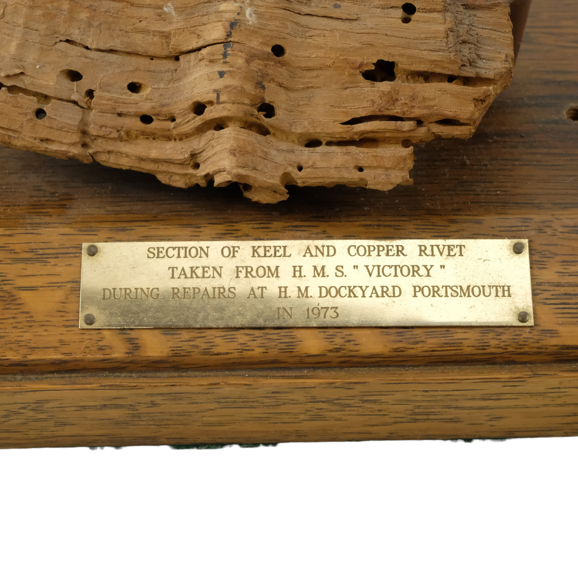 A large fragment of the hull of HMS Victory with copper rivet, mounted ...