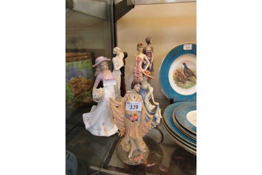 A selection seven of ceramic and moulded figurines of ladies by The ...