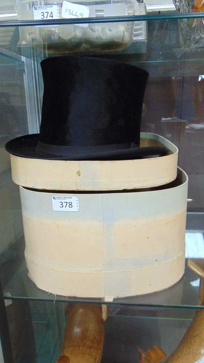 A top hat in box by J.Wippell and Co Ltd Internal circumference: 54cm ...