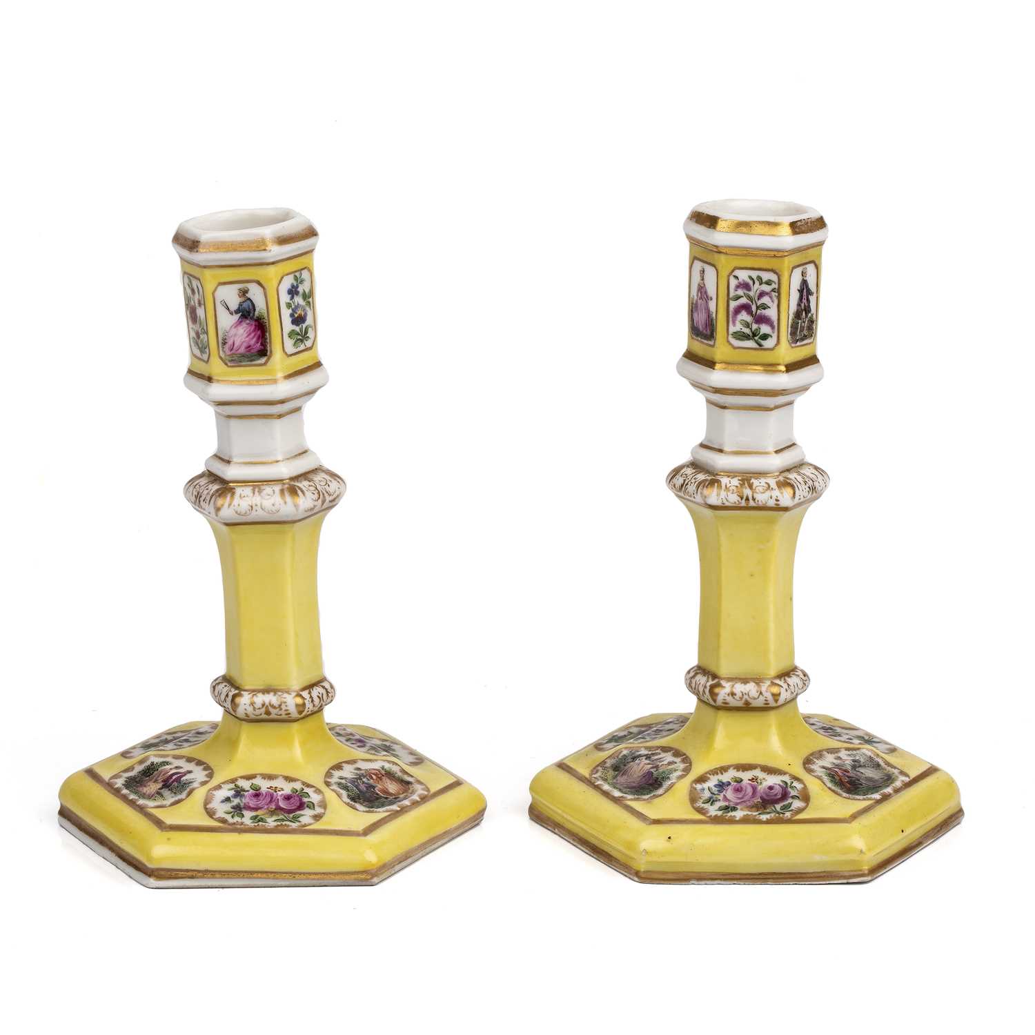 A pair of Berlin porcelain yellow ground candlesticks on hexagonal ...