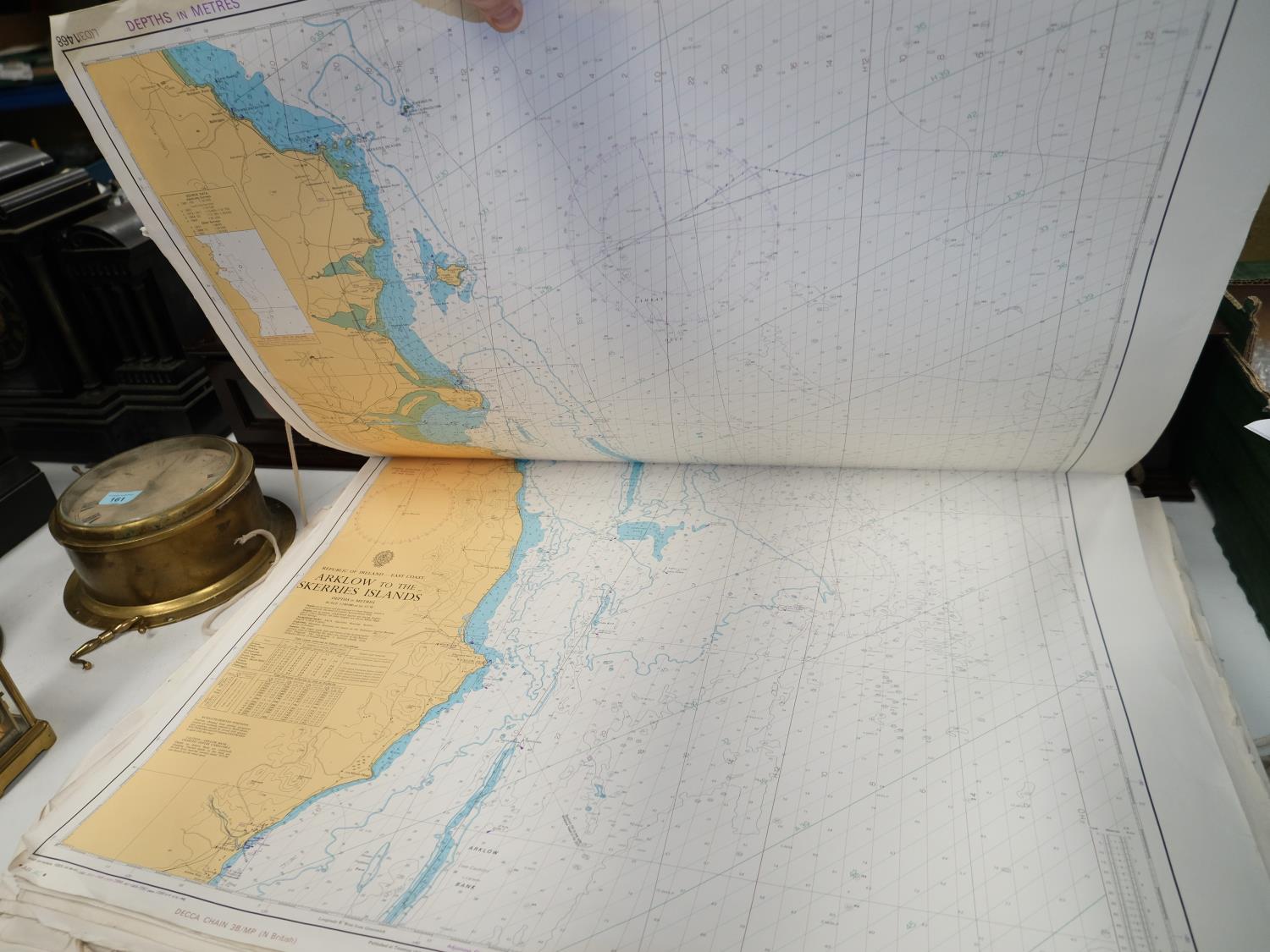 Two folios of maritime charts of the coast round Britain.