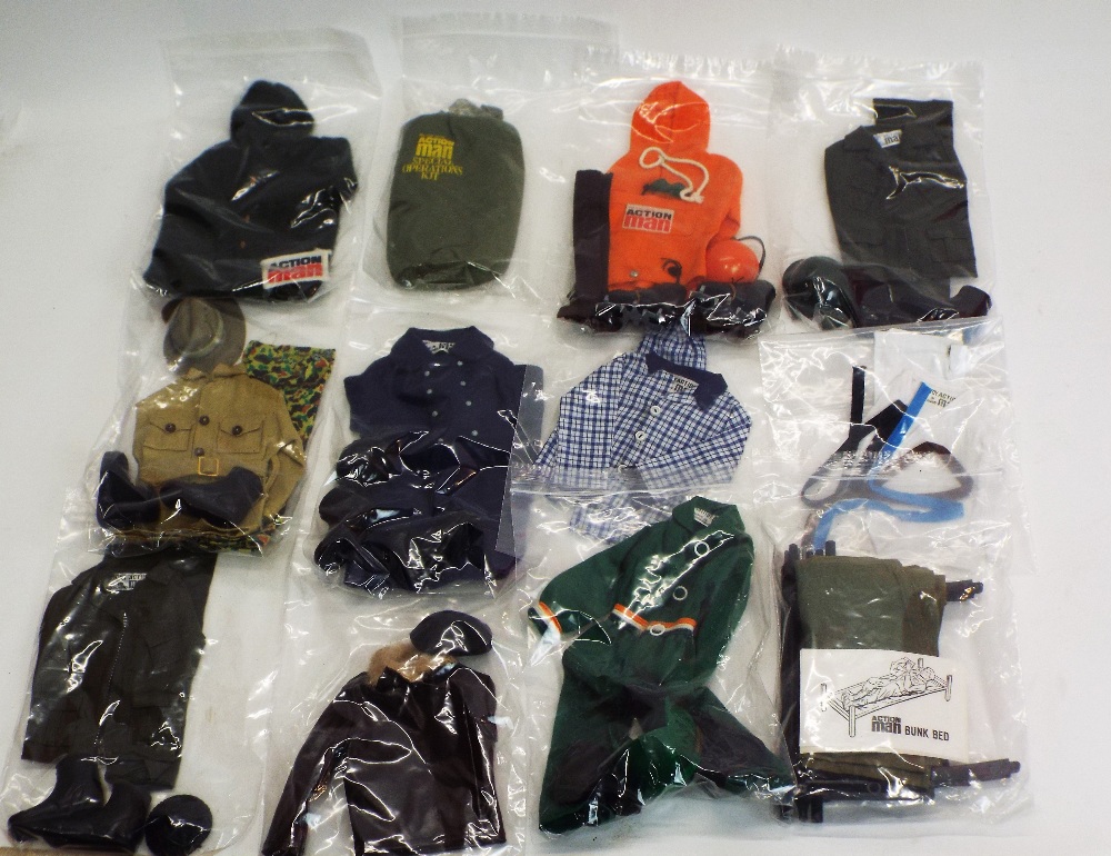 Large collection of action man uniforms and accessories, guns, bunk bed ...