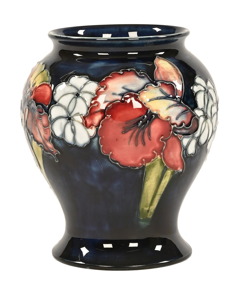 A William Moorcroft Iris patterned vase, signed WM to the base and with ...