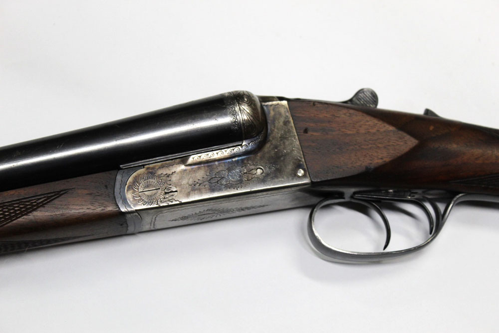 A Laurona 12 bore side by side shotgun, with 28" barrels, half and half ...