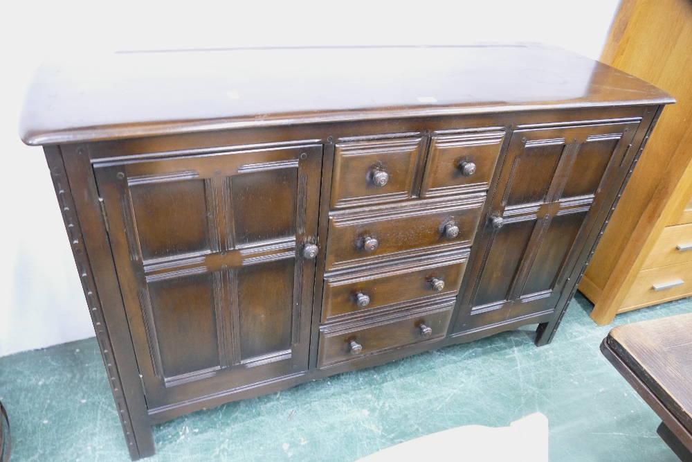 In the manner of Ercol dark sideboard