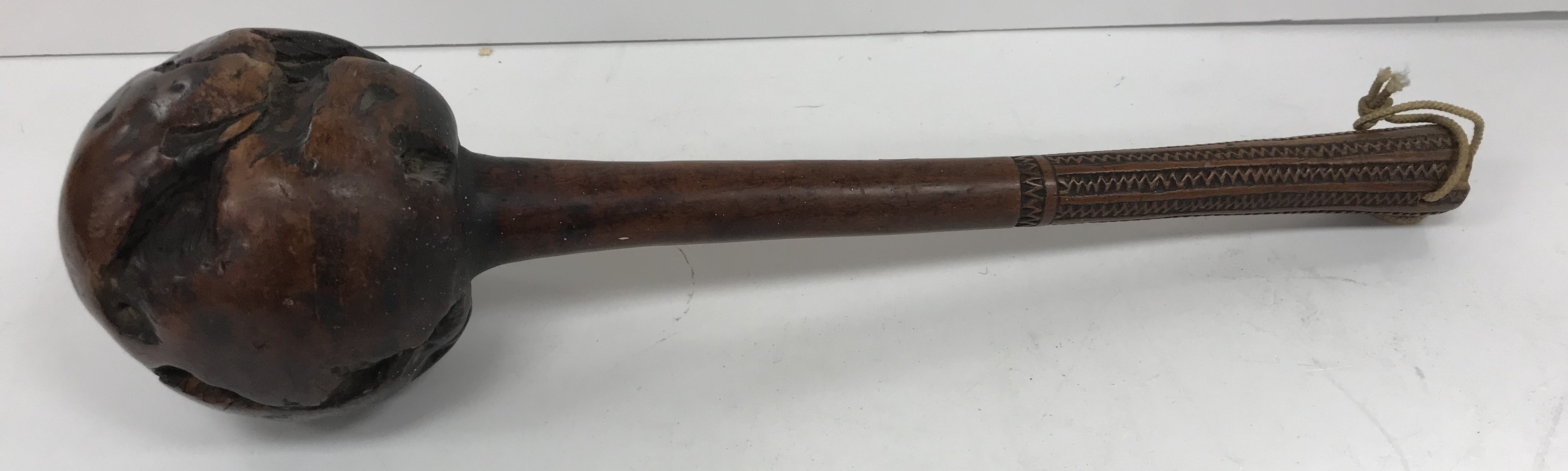 A 19th Century Zulu knobkerrie, the rough ball head on a turned handle ...