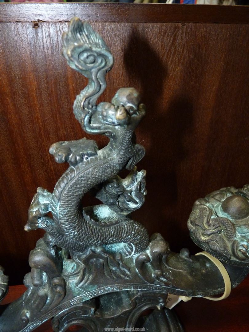 An unusual and heavy bronze figure of a five-toed Dragon breathing fire ...