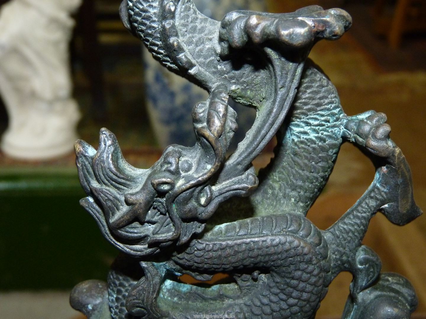 An unusual and heavy bronze figure of a five-toed Dragon breathing fire ...